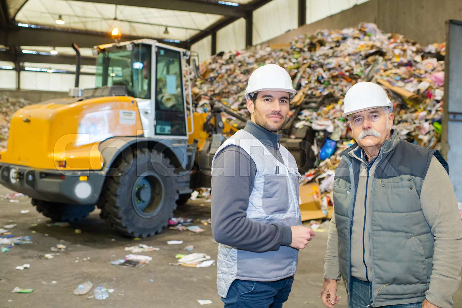 portrait ot two male workers in a recycling center | Stock image ...