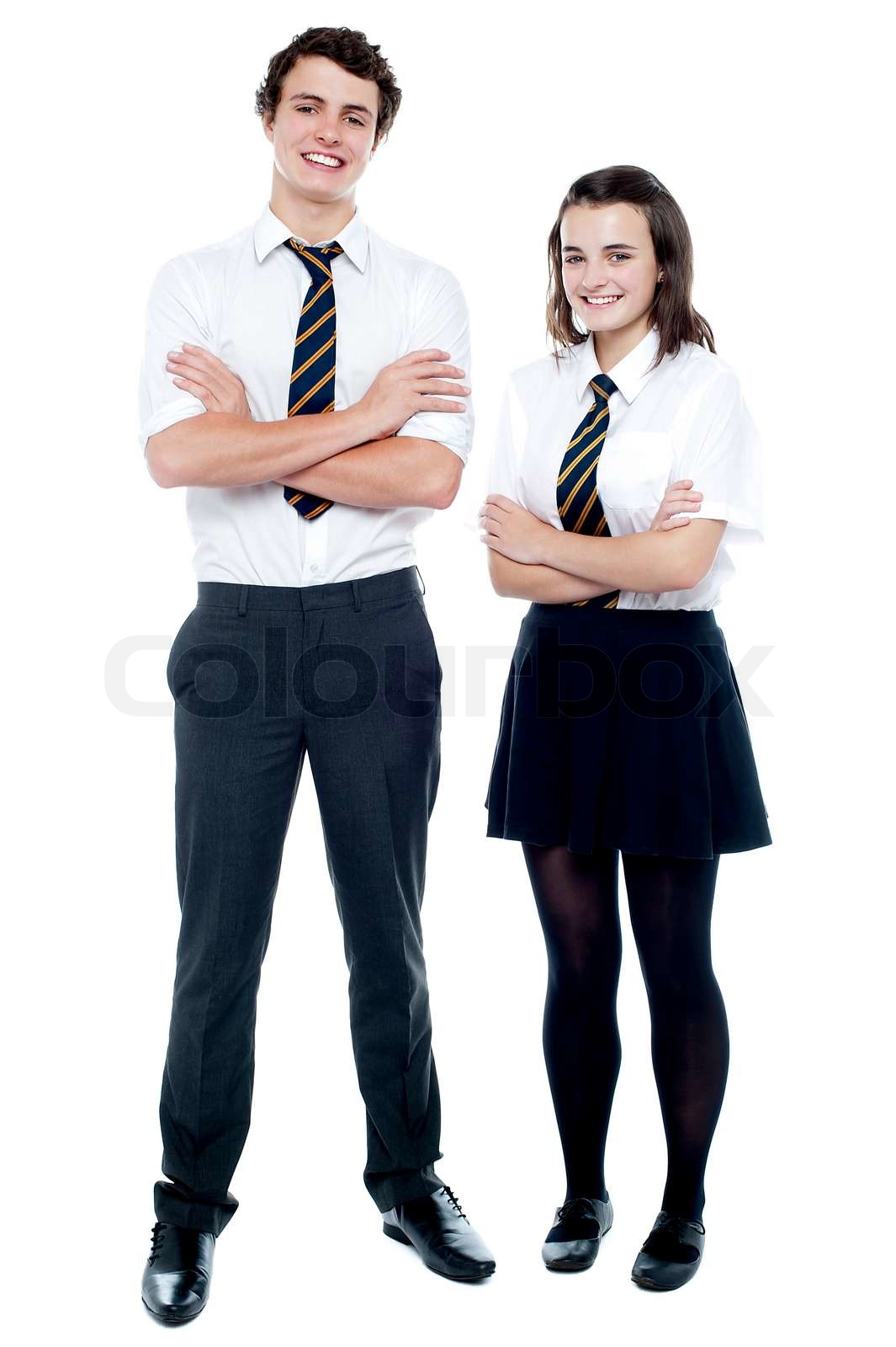 Students in uniform posing with arms crossed | Stock image | Colourbox