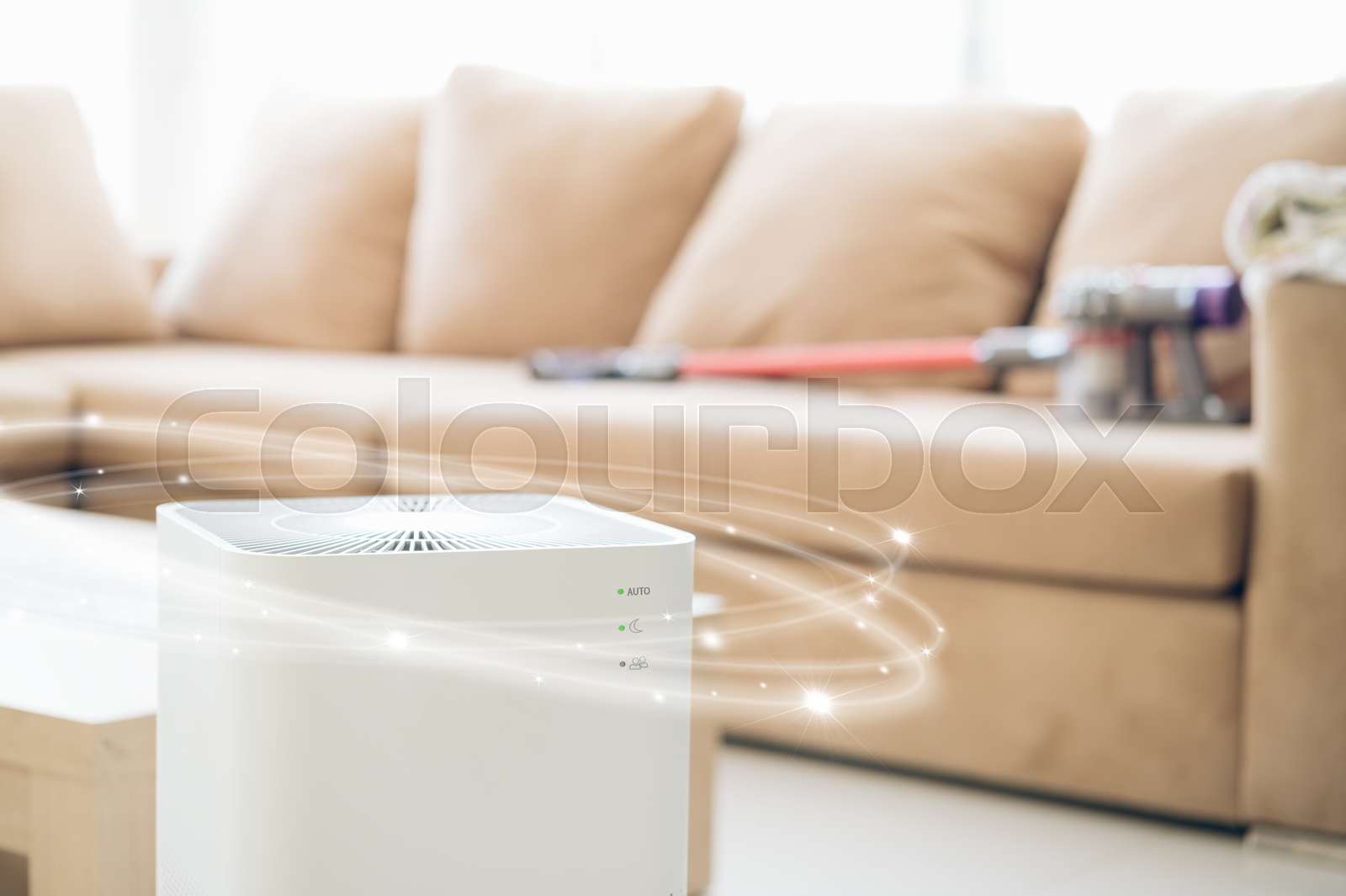 air purifier a living room, air cleaner removing fine dust in house ...