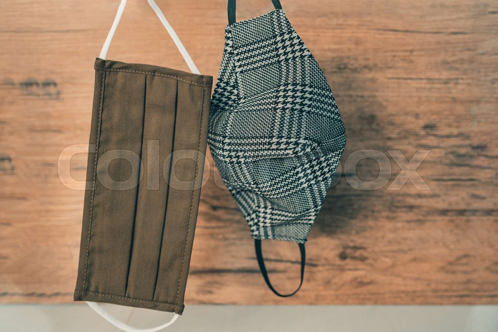 Stylish men face masks hanging in home closet. Different styles for ...