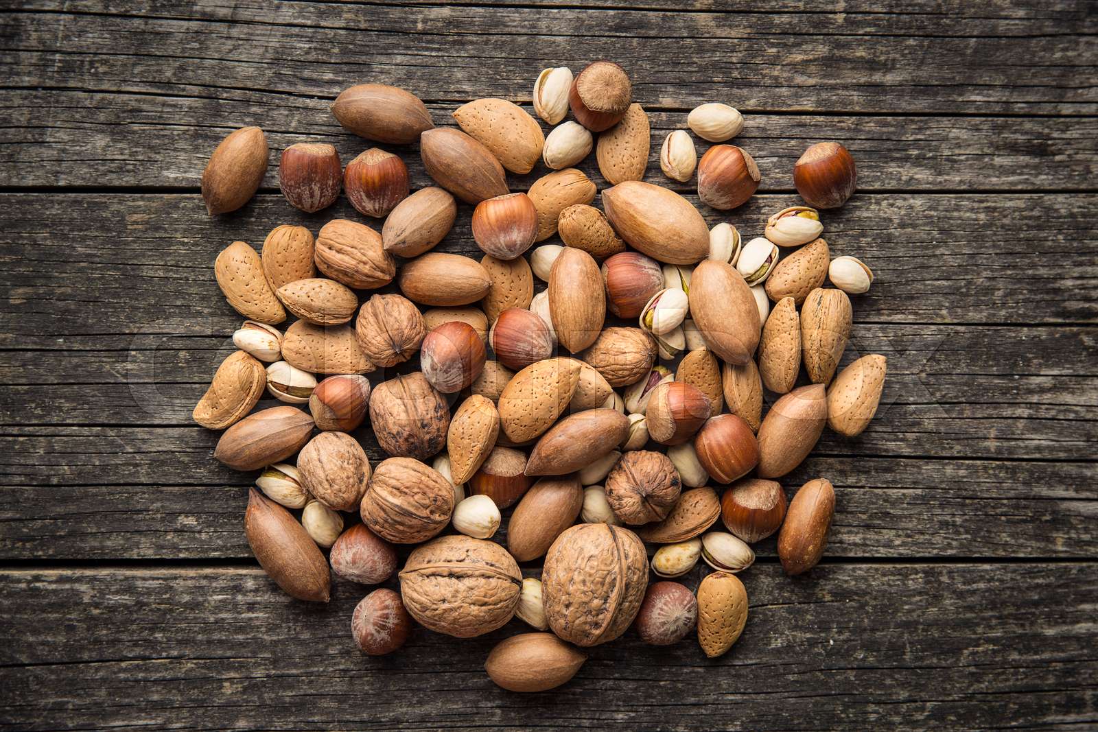Different types of nuts in the nutshell. | Stock image | Colourbox