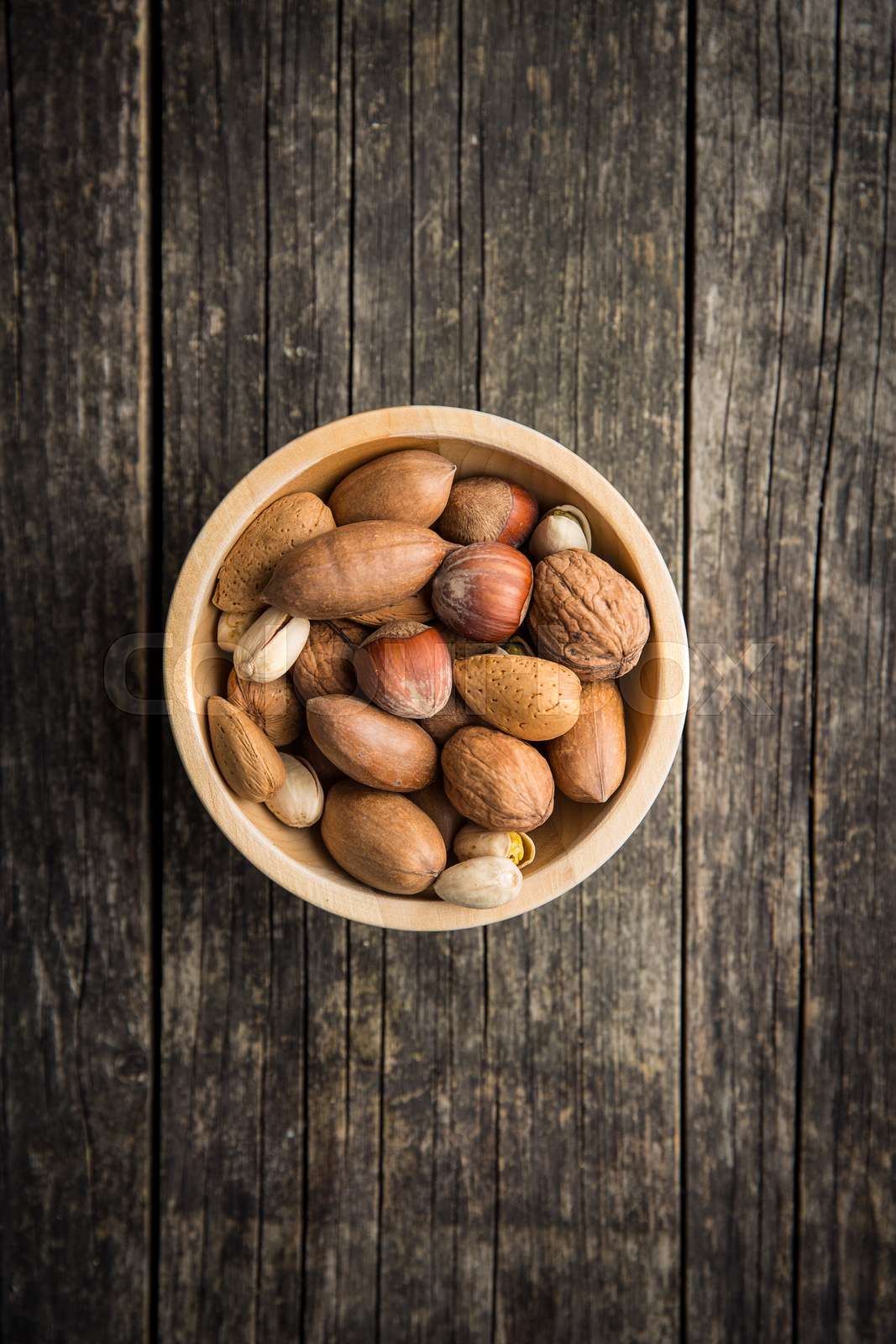 Different types of nuts in the nutshell. | Stock image | Colourbox