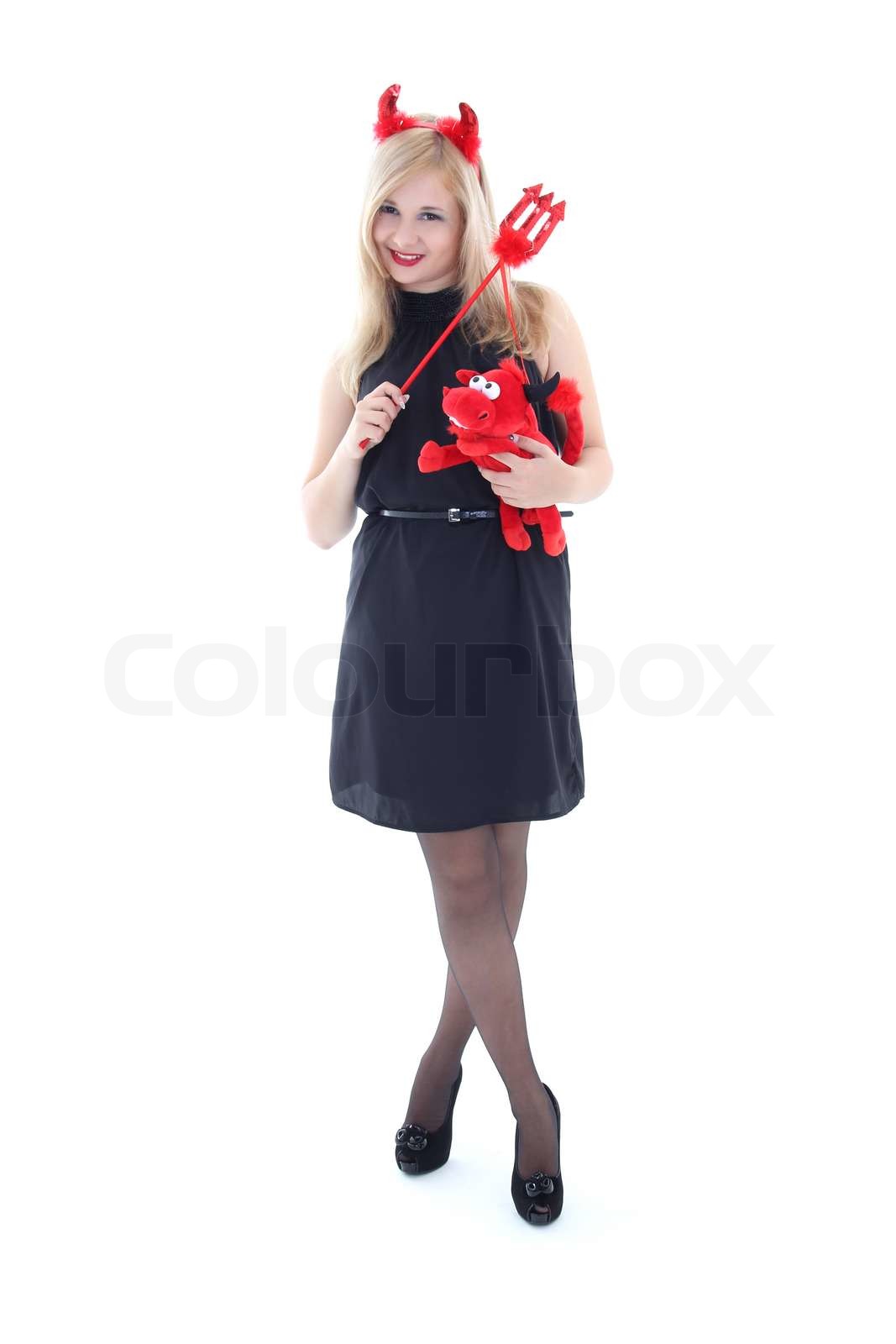 Girl in imp costume with bull | Stock image | Colourbox