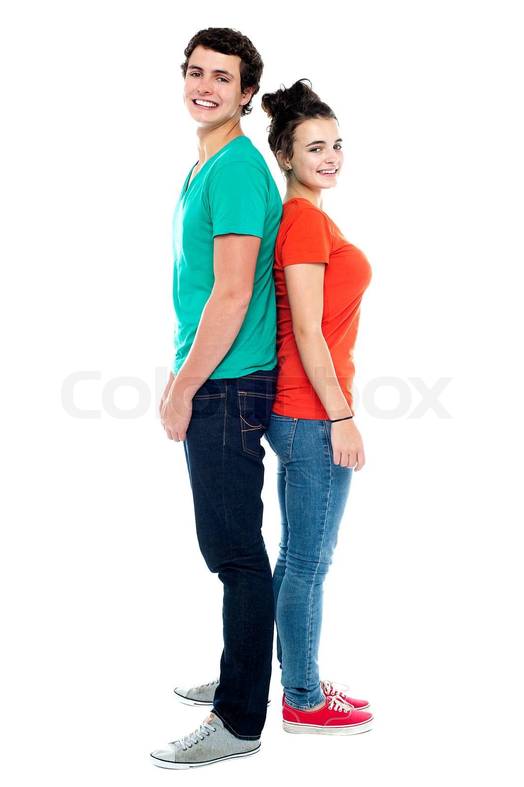 Adorable young couple posing back to back | Stock image | Colourbox