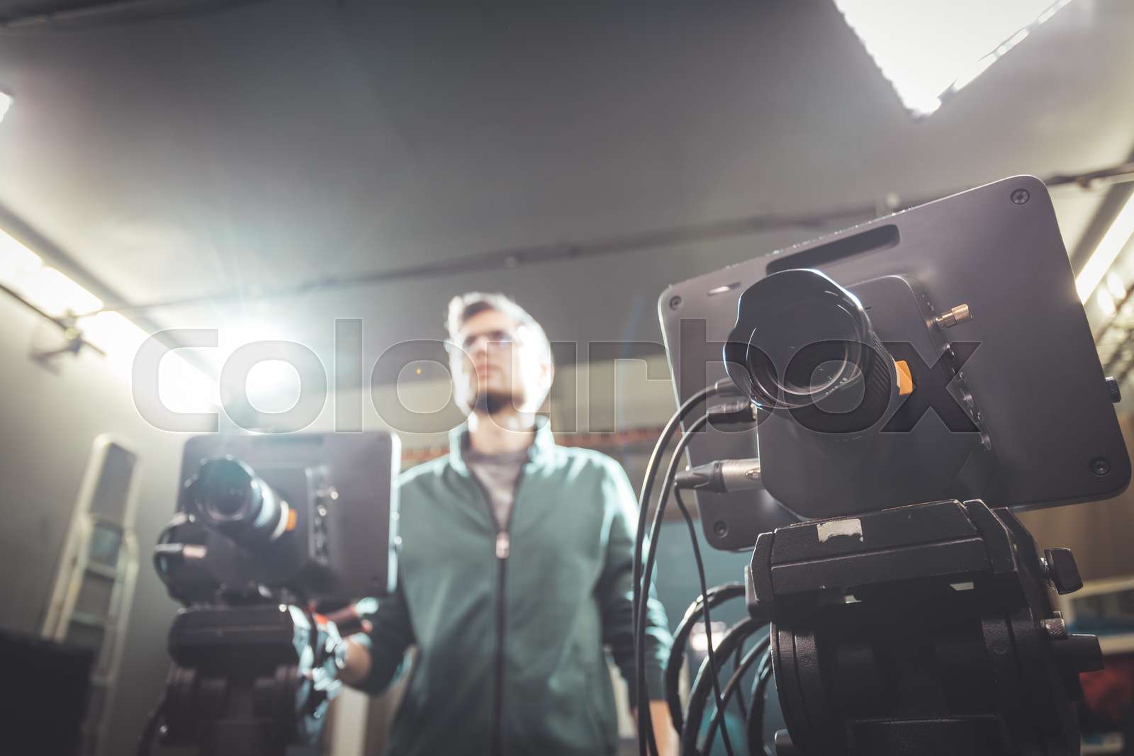 Cameraman operates a film camera, broadcasting recording studio | Stock ...