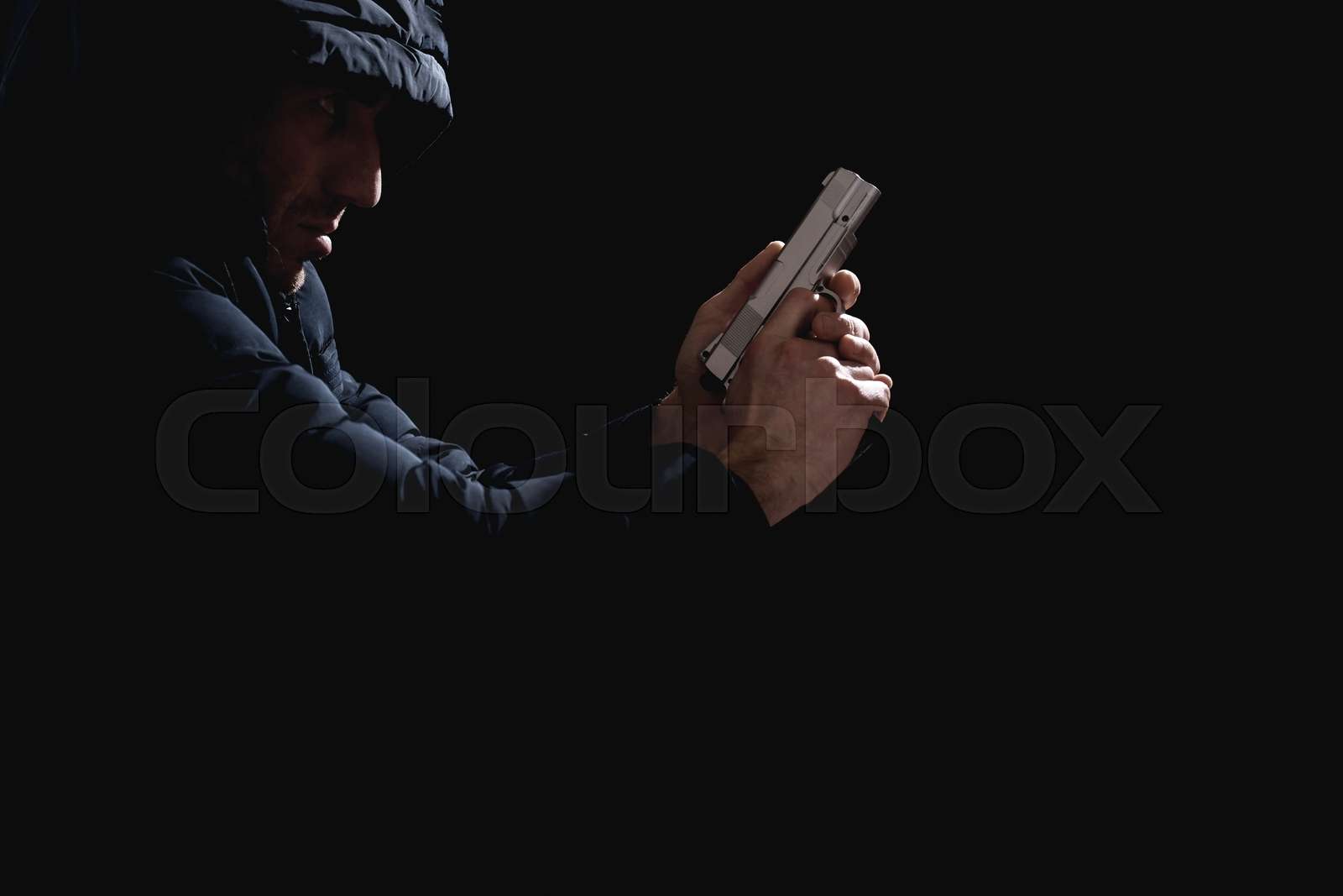 Gangster with gun in the dark. Criminal man with pistol. | Stock image ...