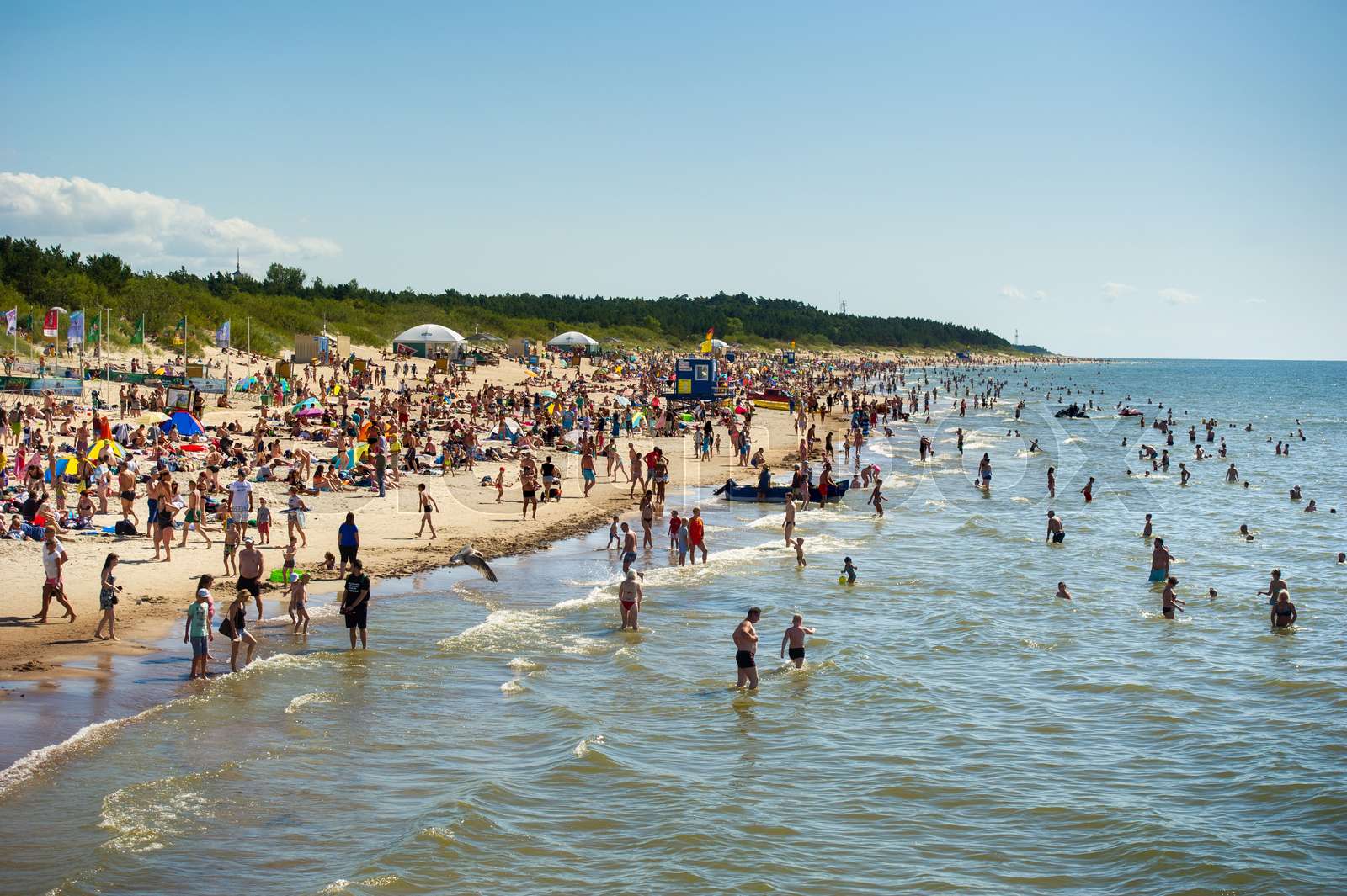 15 August 2017, Palanga, Lithuania. Crowded beach in summer hot bright ...