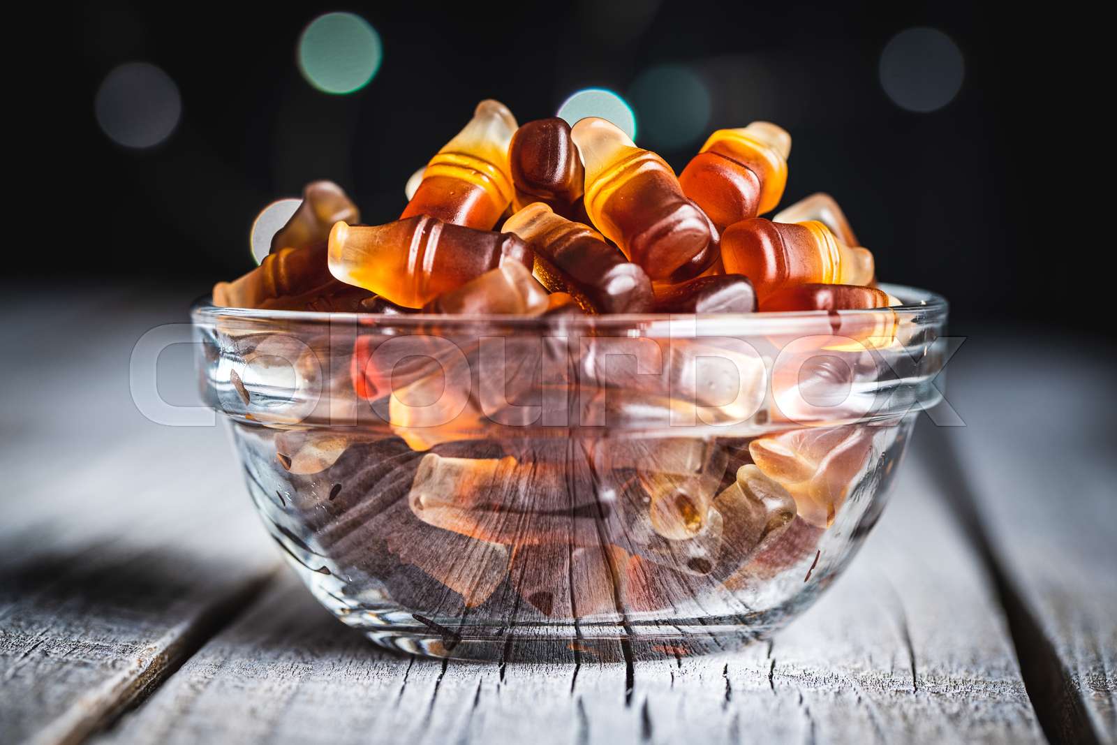Jelly candies with cola flavor in bowl. | Stock image | Colourbox
