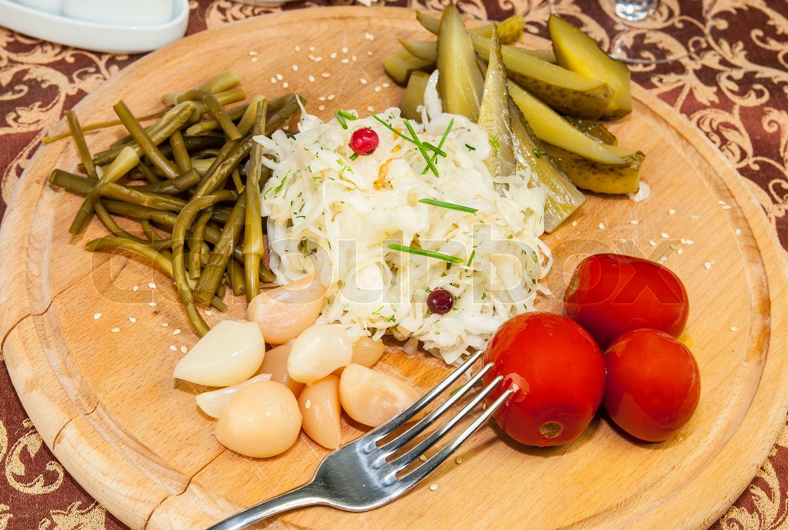 pickles on a white plate in a restaurant | Stock image | Colourbox