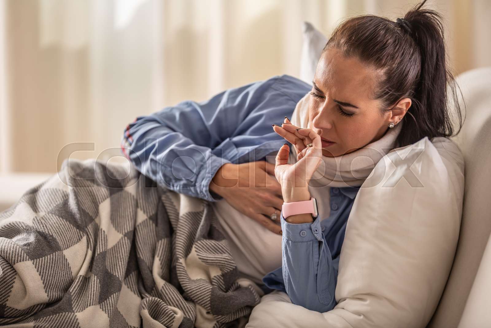 Young woman suffering from heavy cough and lungs problems having flu or ...