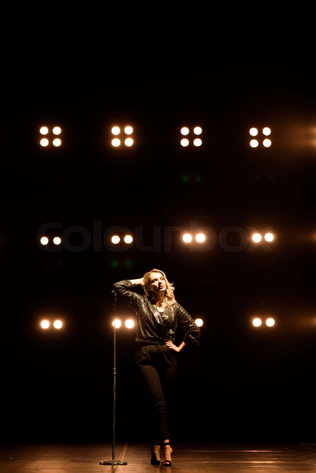Singer on scene in the club. Bright stage lighting. | Stock image ...