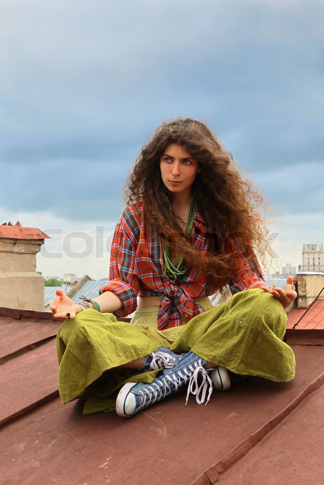 Girl on a roof | Stock image | Colourbox