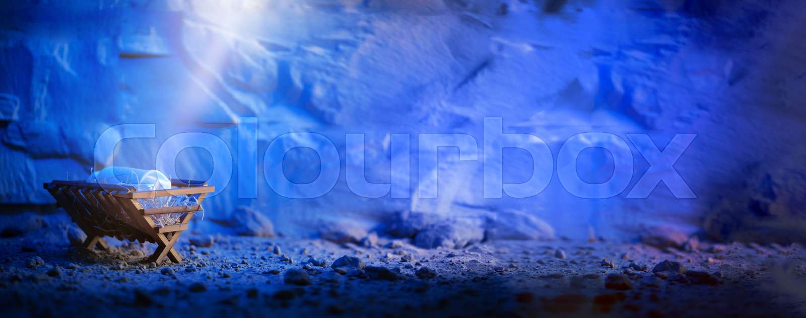 Wooden manger and star of Bethlehem in cave, nativity scene background ...