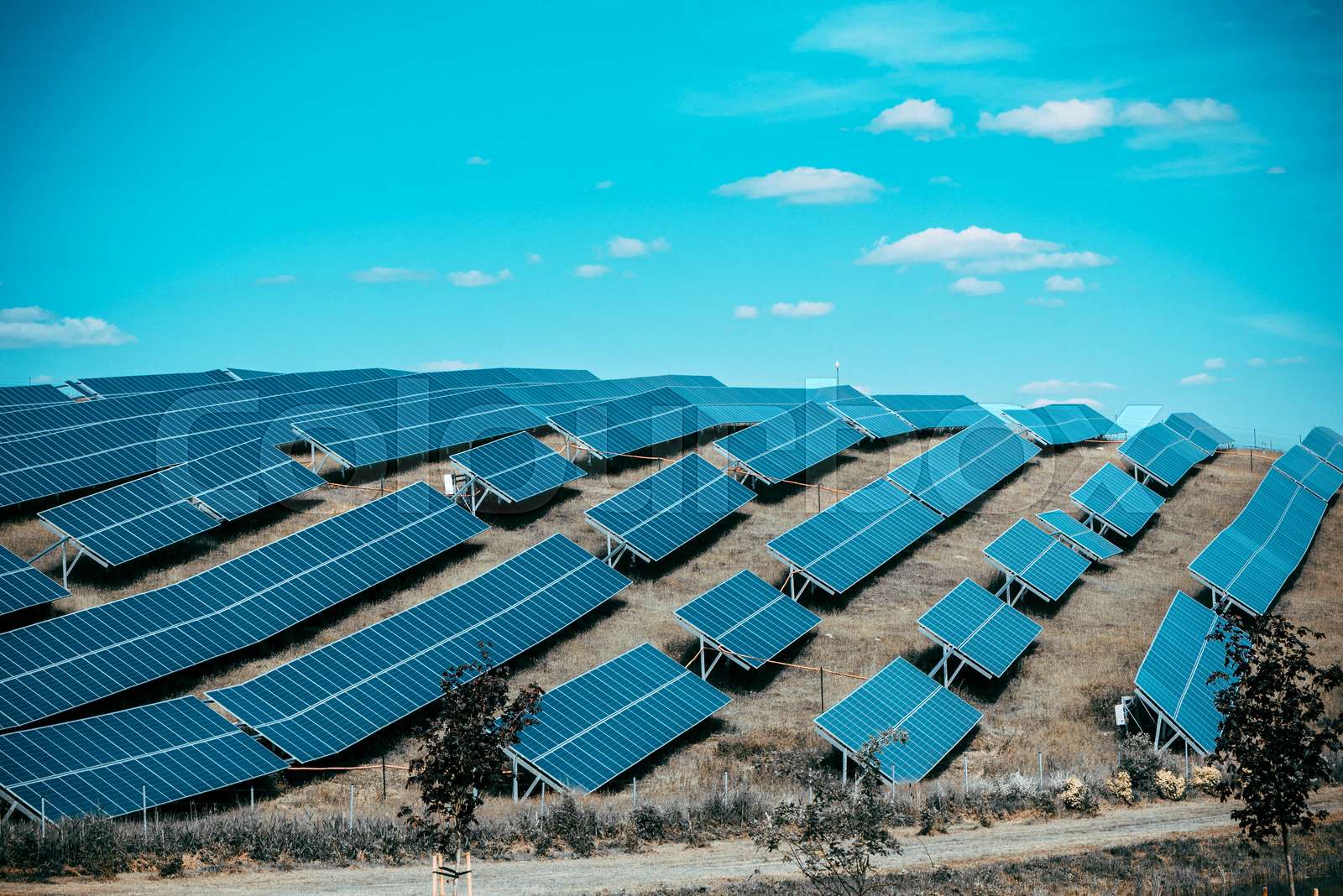 Solar panels against blue sunny sky produce green, environmentally ...