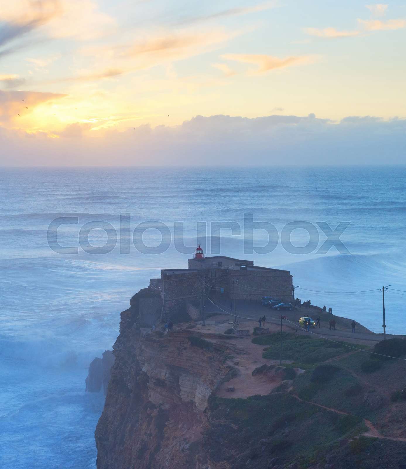 Nazare lighthouse sunset ocean Portugal | Stock image | Colourbox