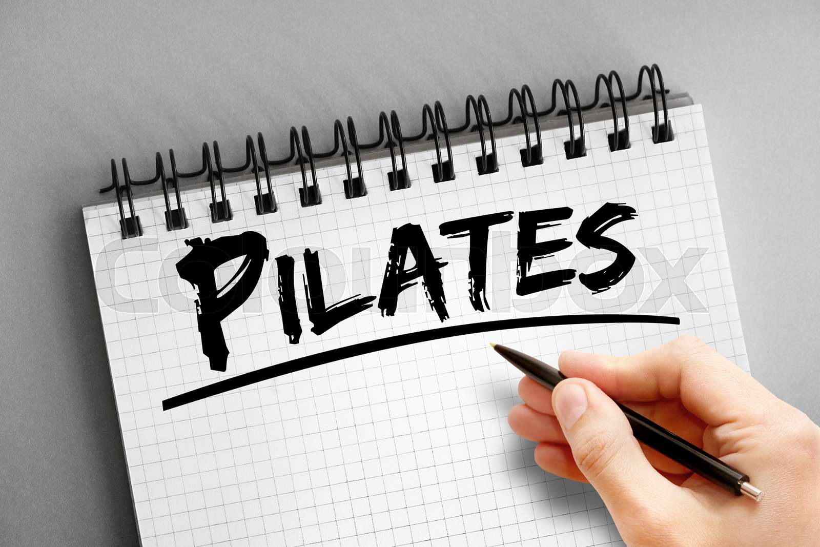 Pilates text on notepad, sport concept background | Stock image | Colourbox