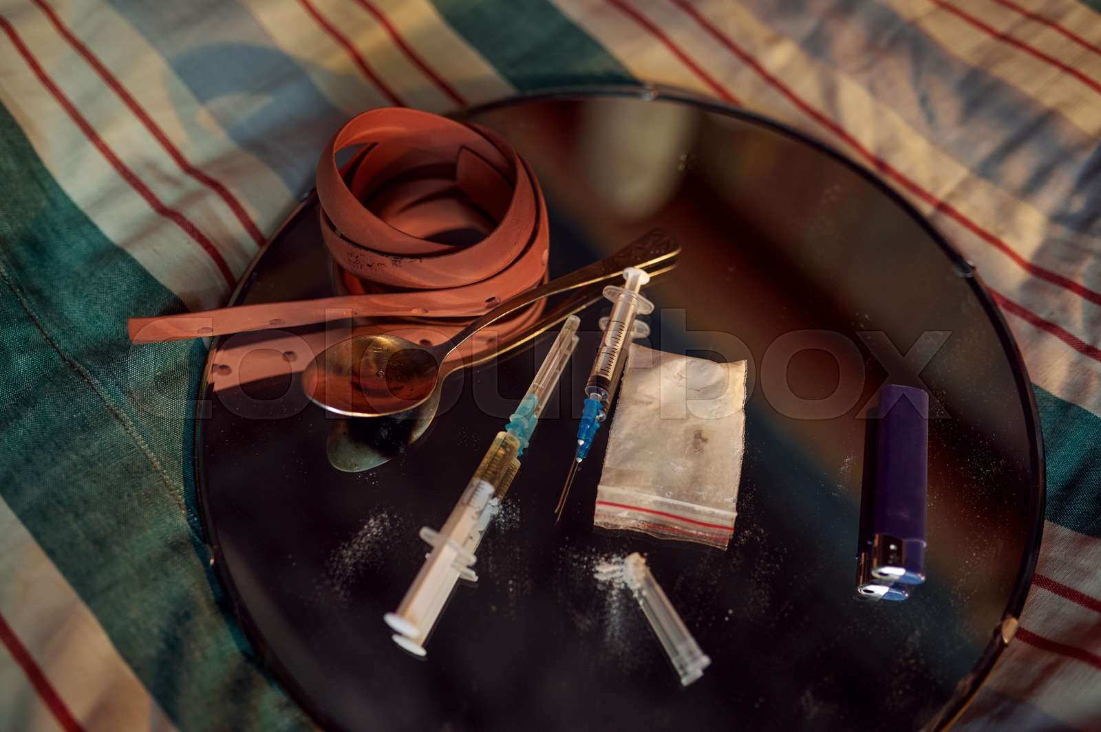 Drug addicts tools, syringe, spoon and tourniquet | Stock image | Colourbox