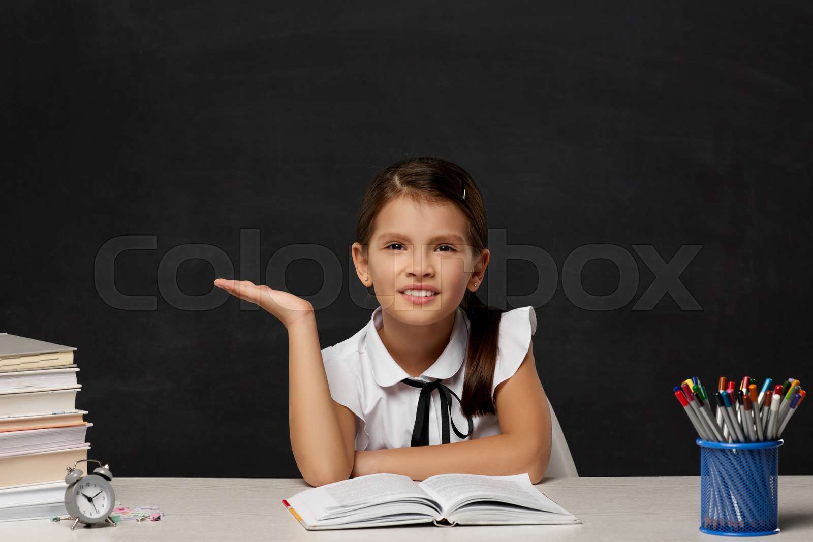 puzzled little child girl in the classroom | Stock image | Colourbox