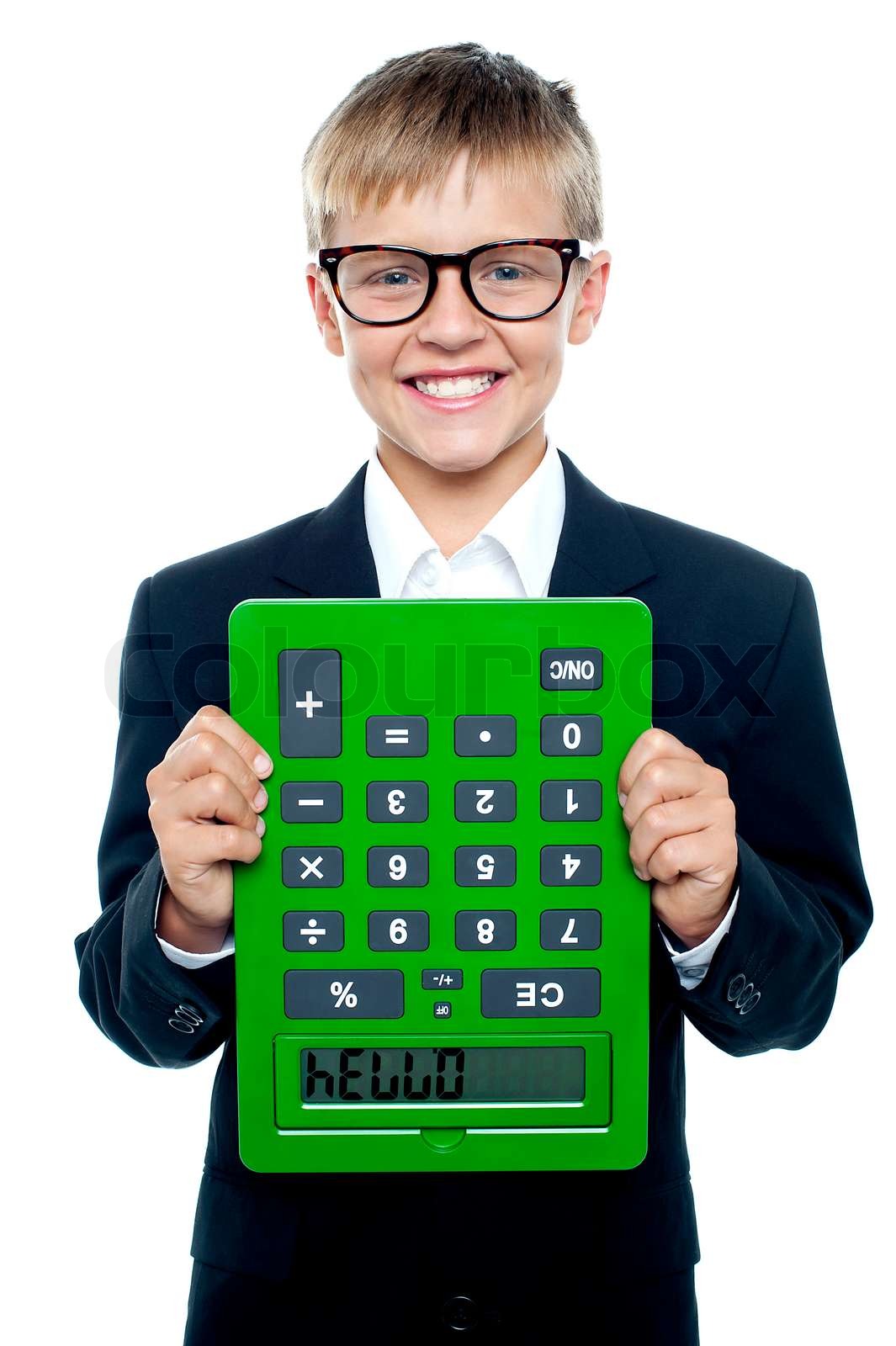 School boy holding calculator upside down | Stock image | Colourbox