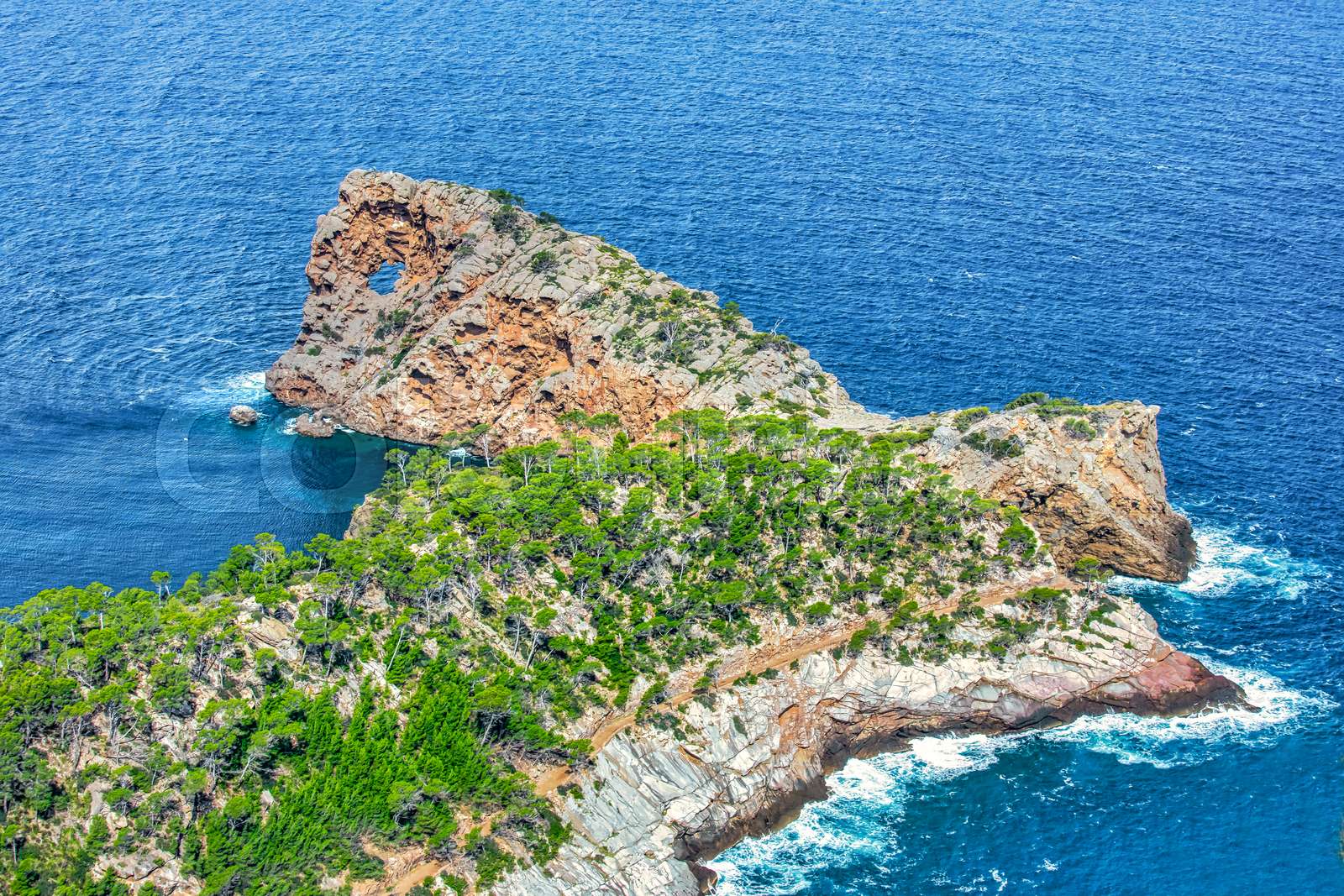 The Sa Foradada rockhole near Deia in the west of Mallorca | Stock ...
