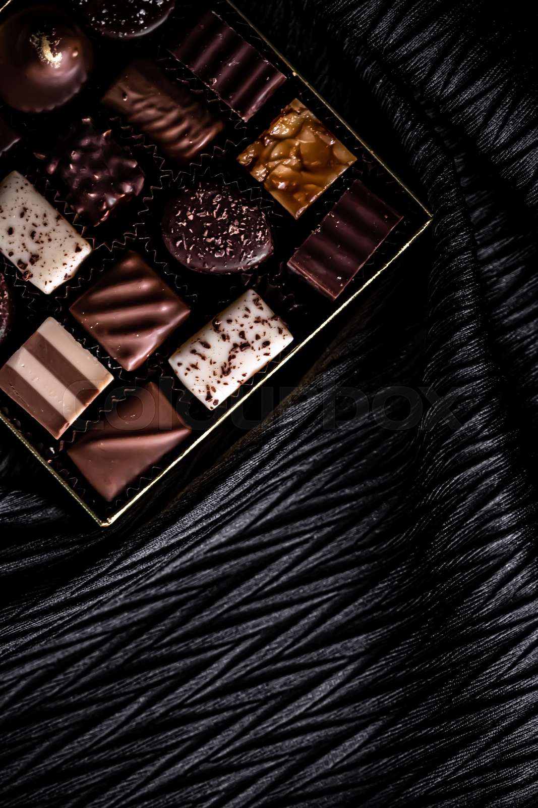 Swiss chocolates in gift box, various luxury pralines made of dark and ...