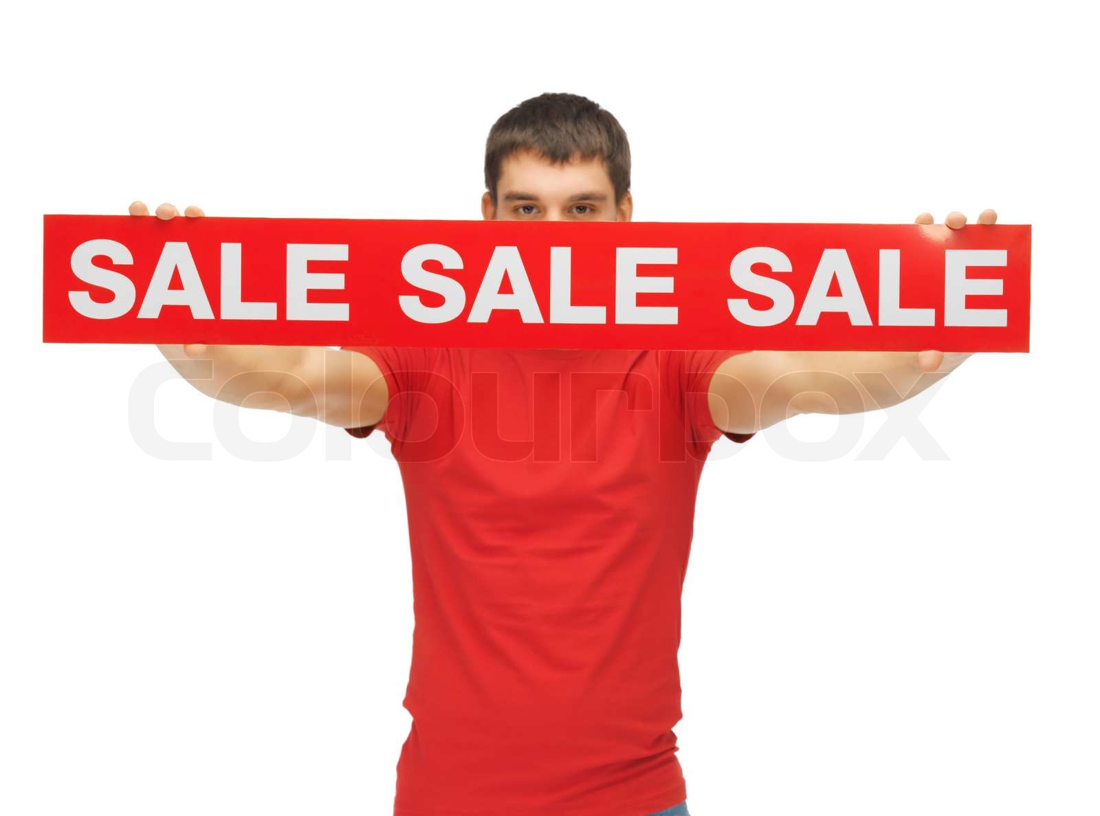bright picture of man holding sale sign | Stock image | Colourbox