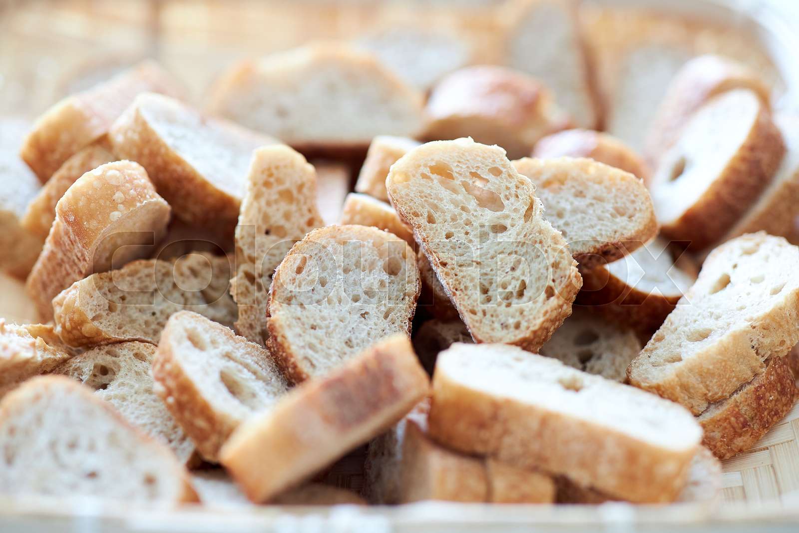small fresh crisp bread pieces in basket | Stock image | Colourbox