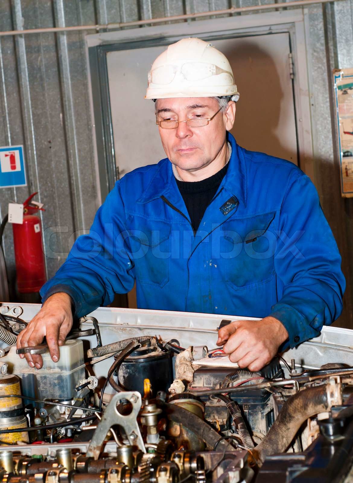 worker repair engine | Stock image | Colourbox