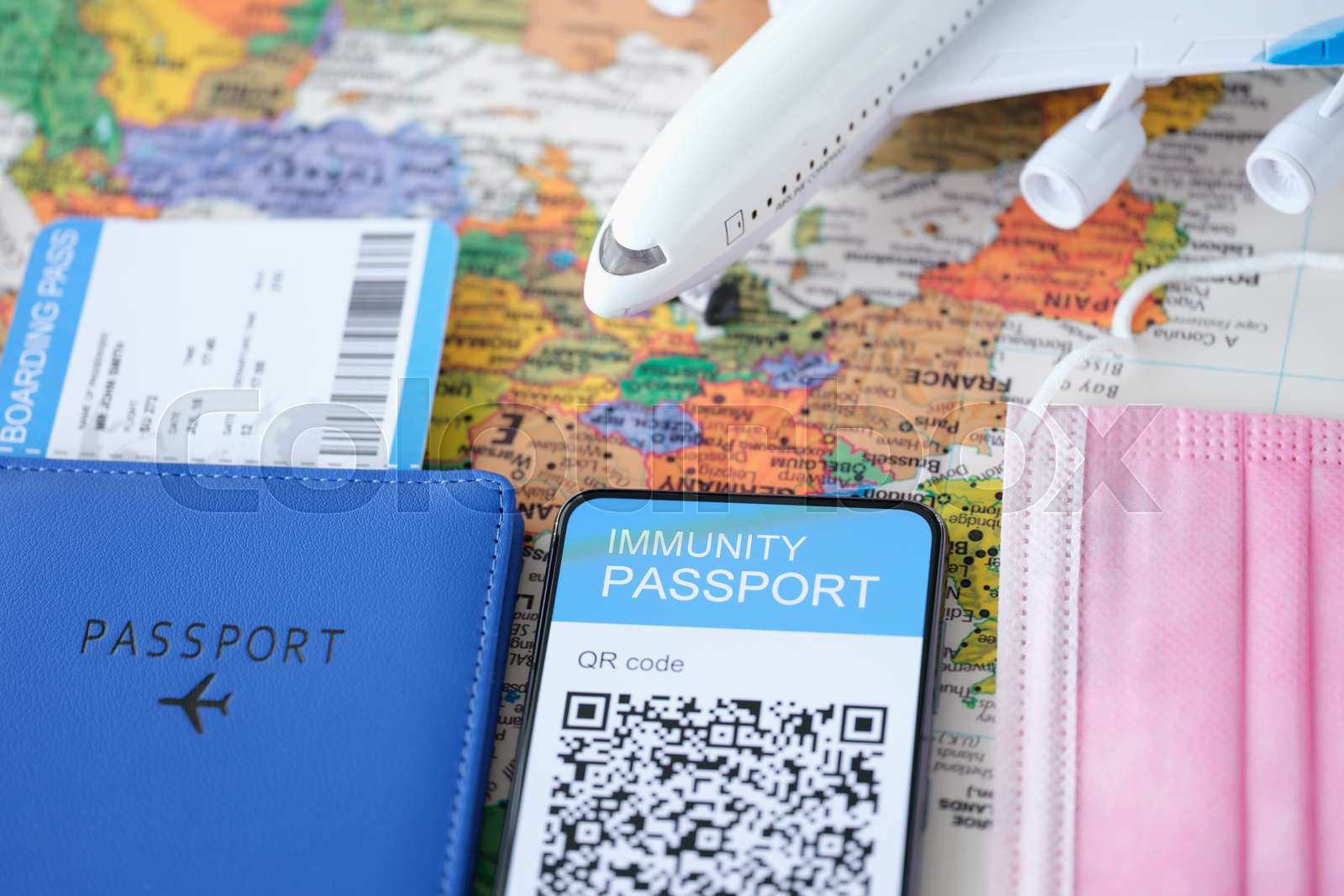 Covid 19 vaccine passport qr code on smartphone screen and airplane ...