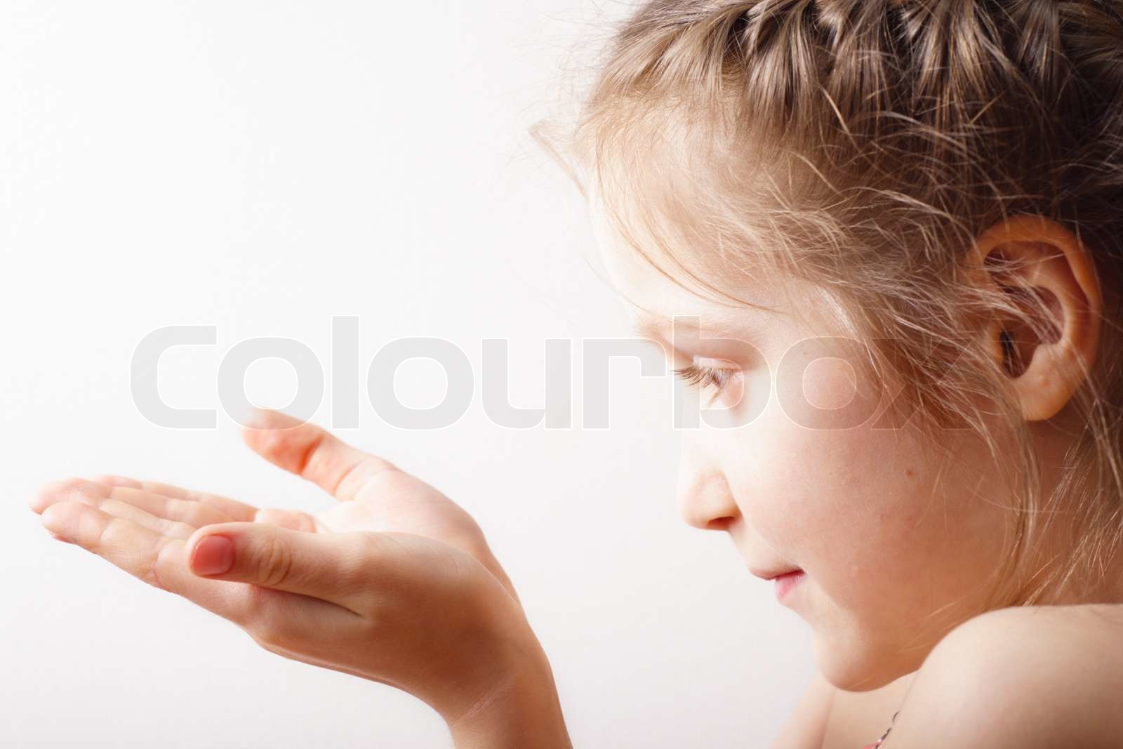 child holding something shining | Stock image | Colourbox