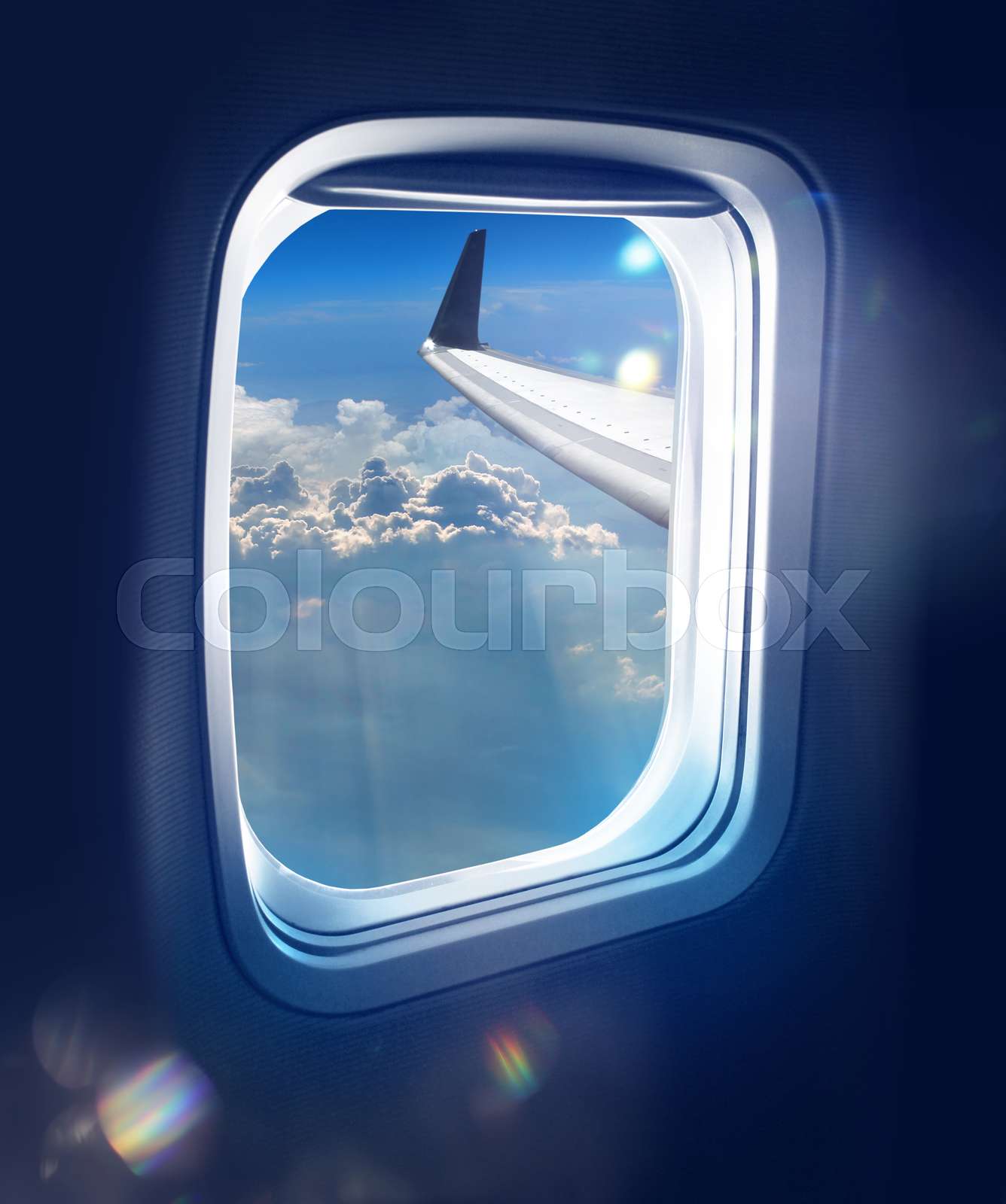 Bright view from a jet plane window high on the blue skies | Stock ...
