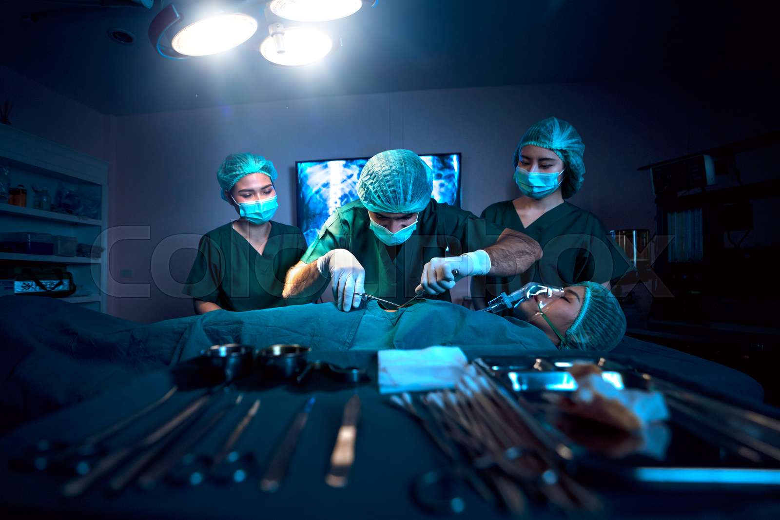 Professional medical team performing surgery | Stock image | Colourbox