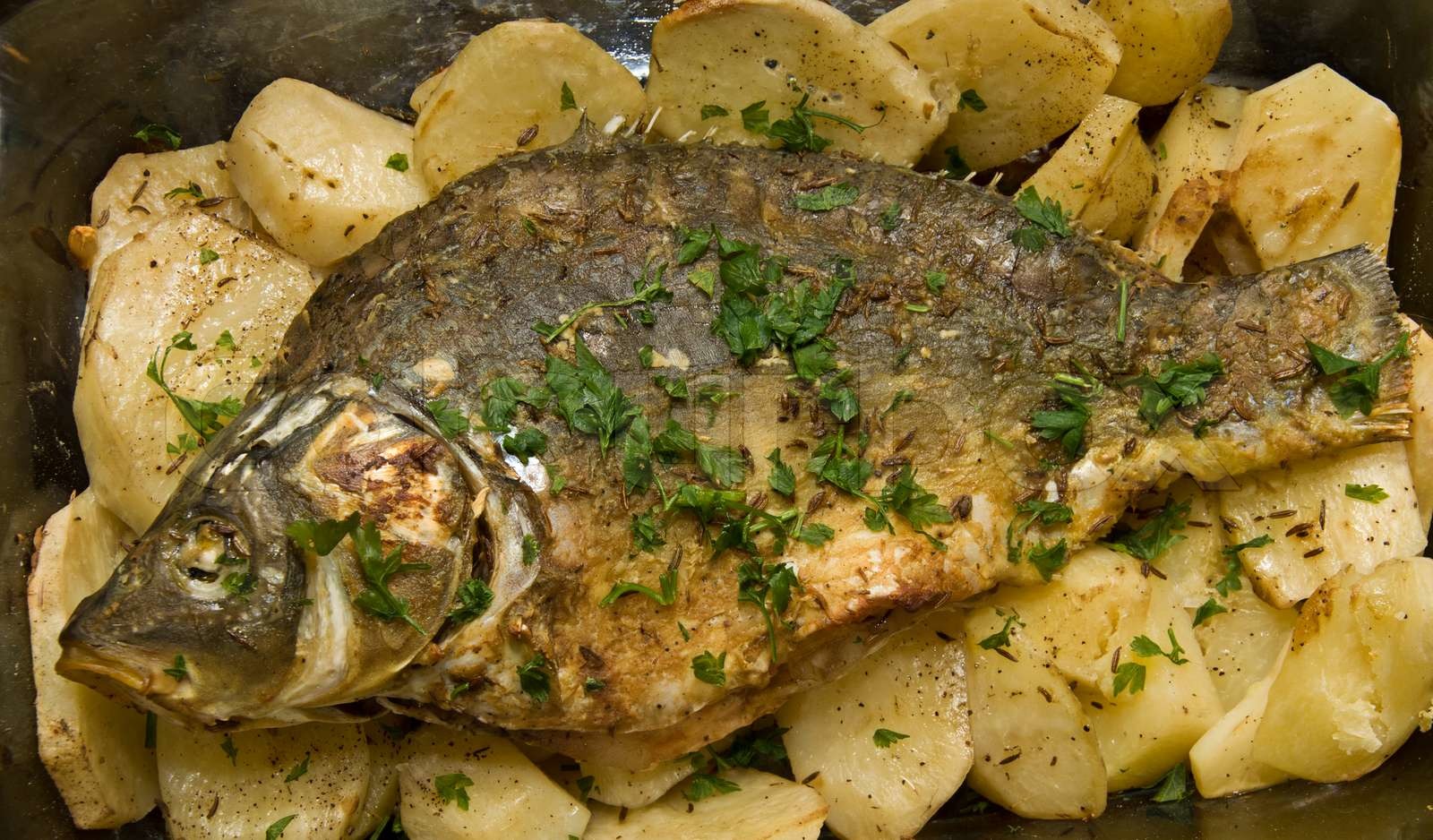 baked fish and potatoes | Stock image | Colourbox