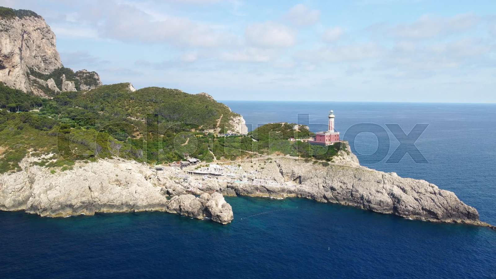 Capri Lighthouse from a moving drone in summer season | Stock video ...
