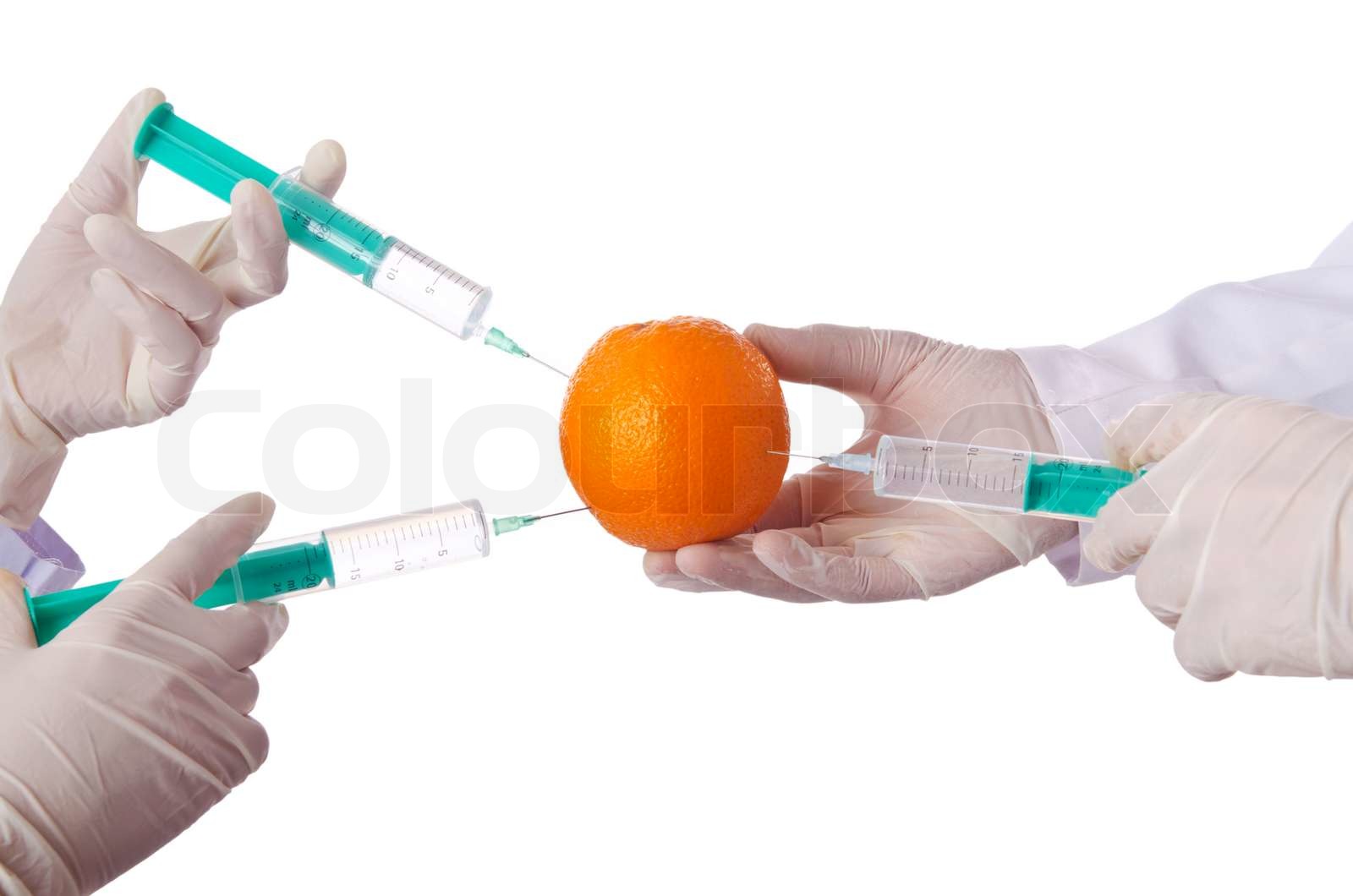 Science experiment with orange and syringe | Stock image | Colourbox