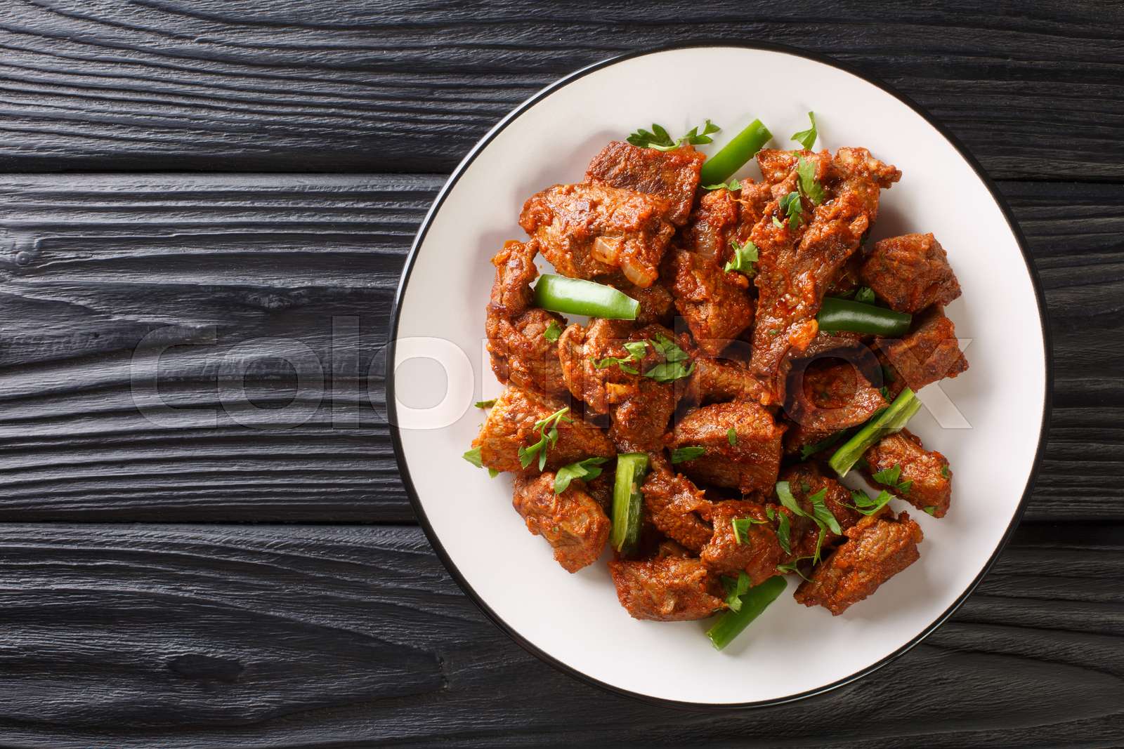 Ethiopian cuisine Tibs fried beef meat in a spicy vegetable sauce close ...