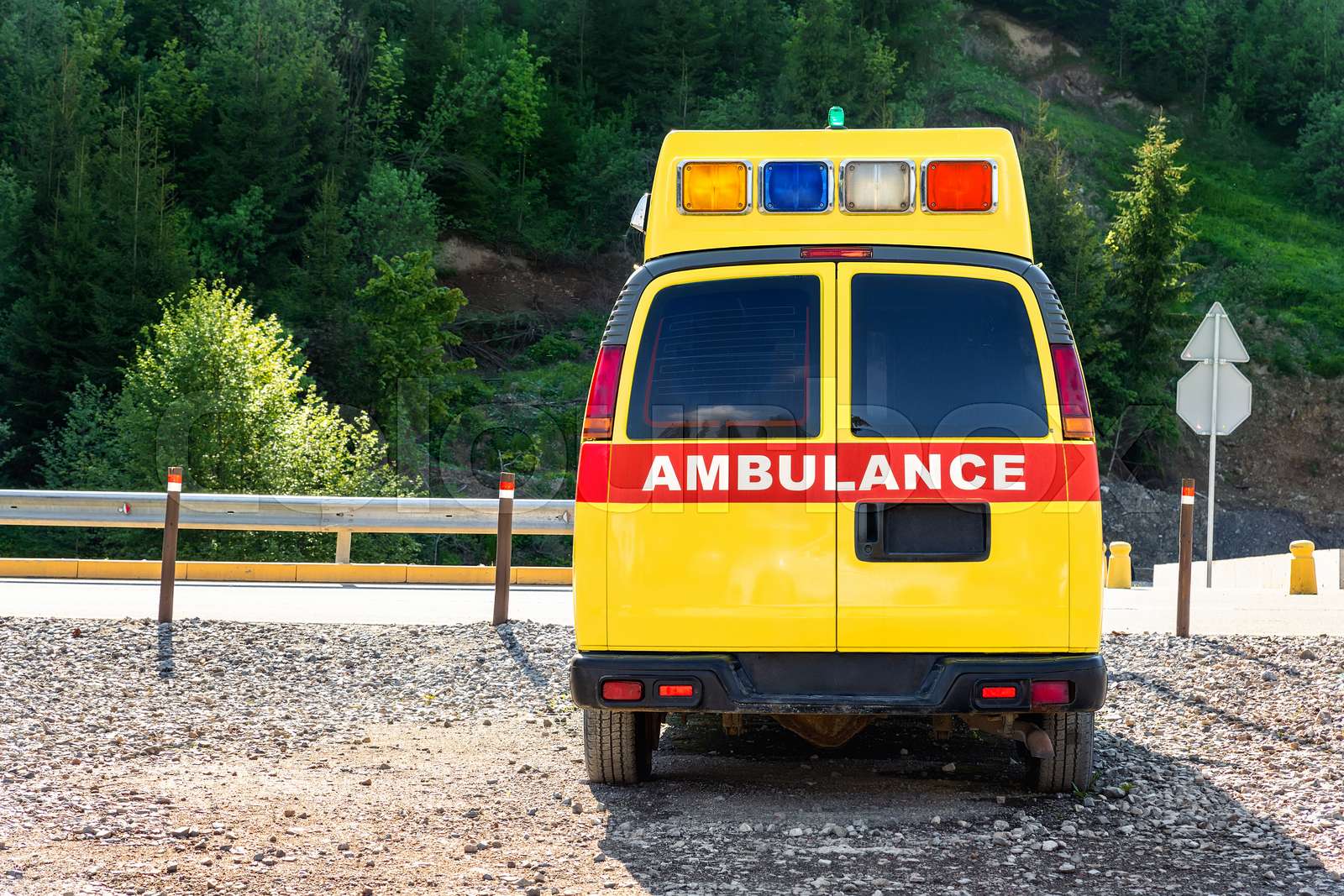 Back door view of yellow ambulance rescue ems van car parked near ...