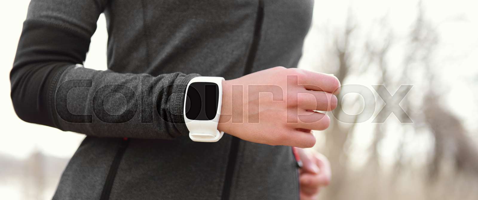 Sports smartwatch woman running using wearable technology during ...