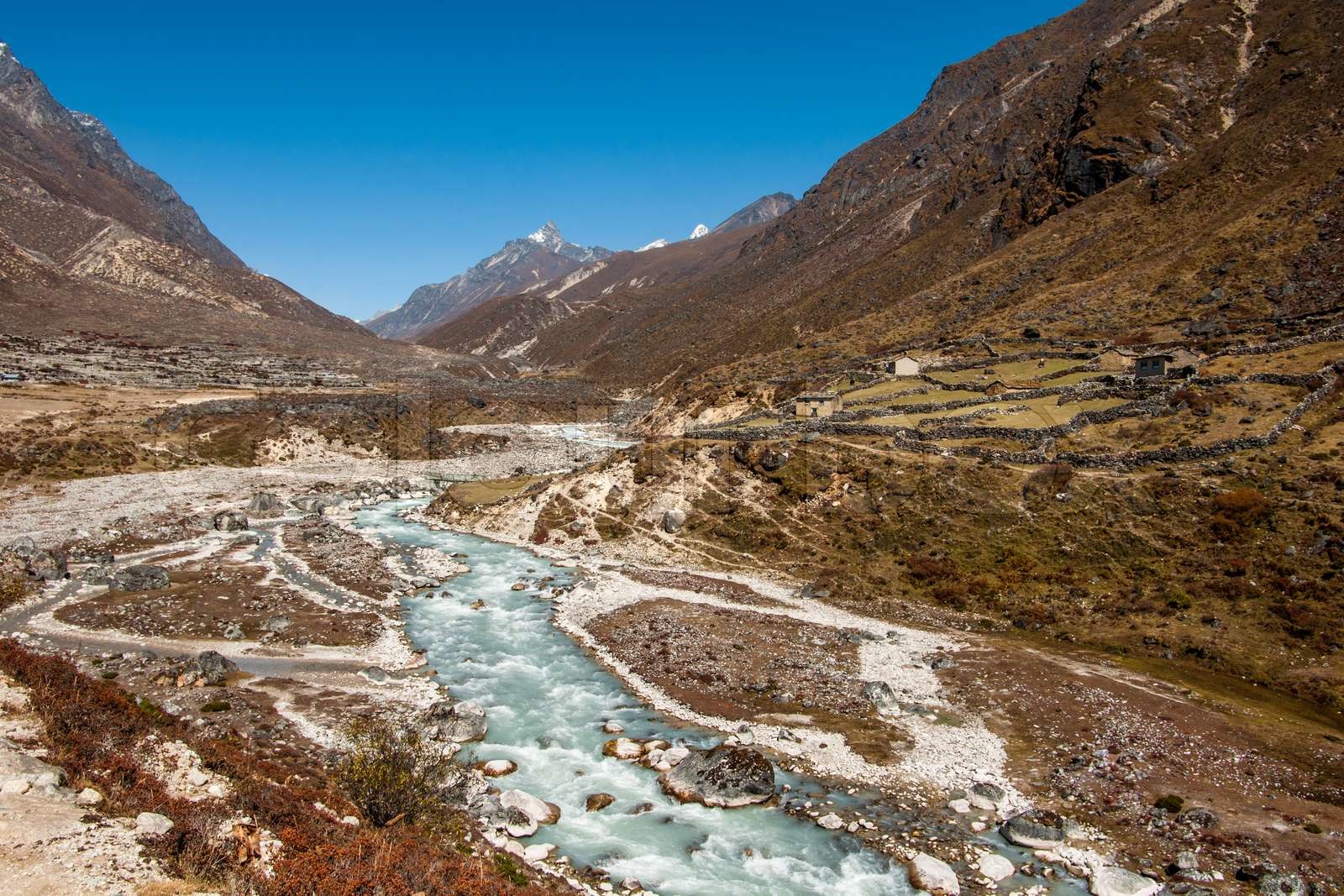 Village and drained river in Himalaya | Stock image | Colourbox