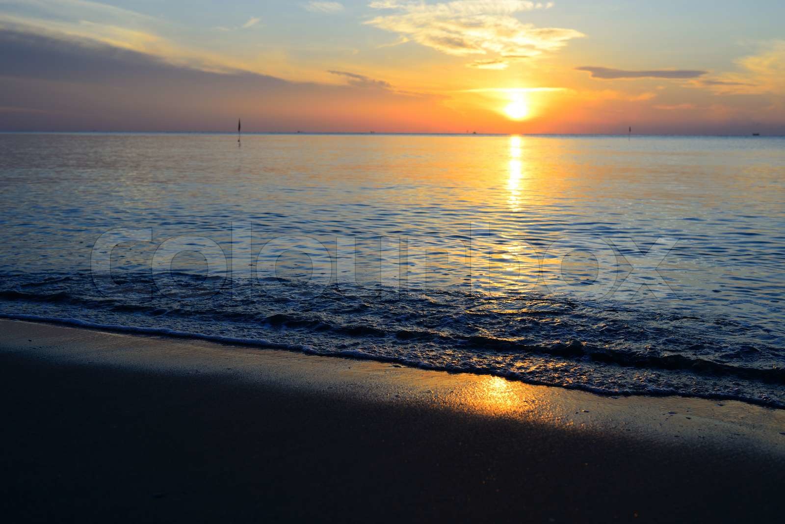 The sunrise shine and reflect on the beach | Stock image | Colourbox