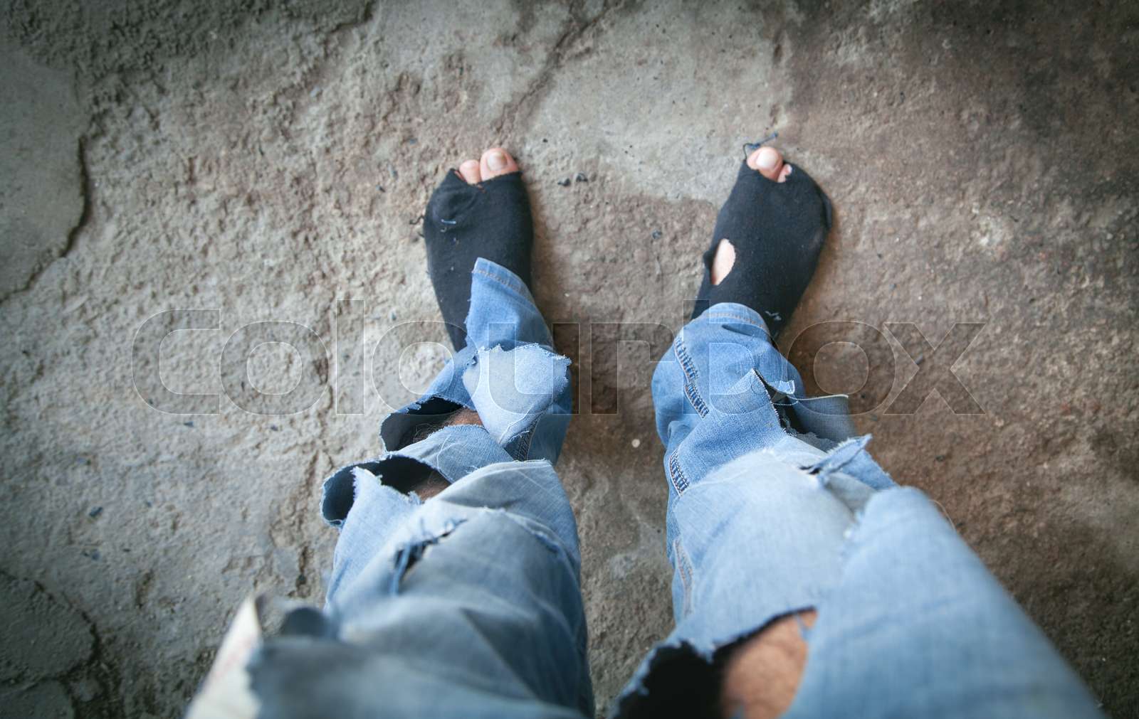 Poor feets of a caucasian homeless man. | Stock image | Colourbox