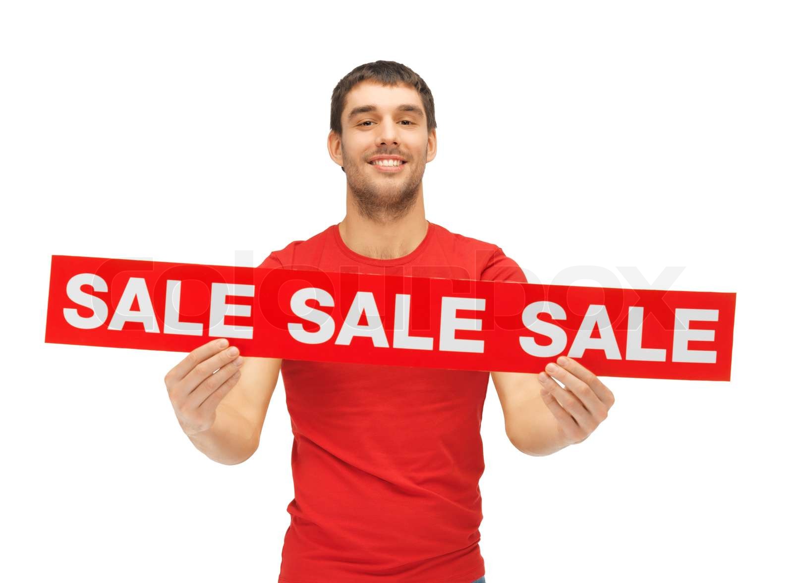 handsome man with sale sign | Stock image | Colourbox