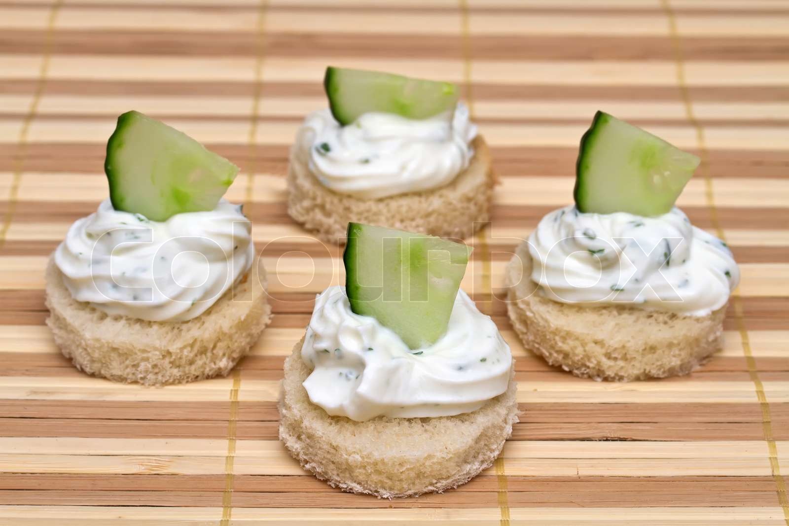 Canapé with spicy cream cheese and cucumber | Stock image | Colourbox