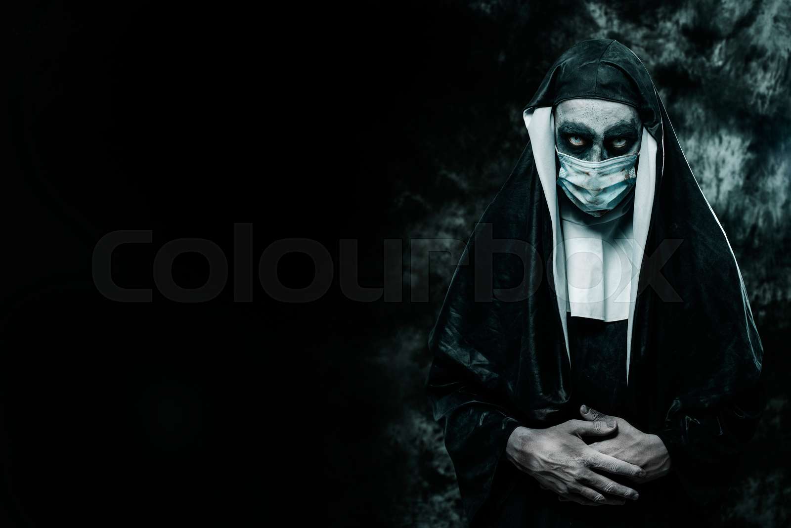 scary evil nun wearing a disposable face mask | Stock image | Colourbox
