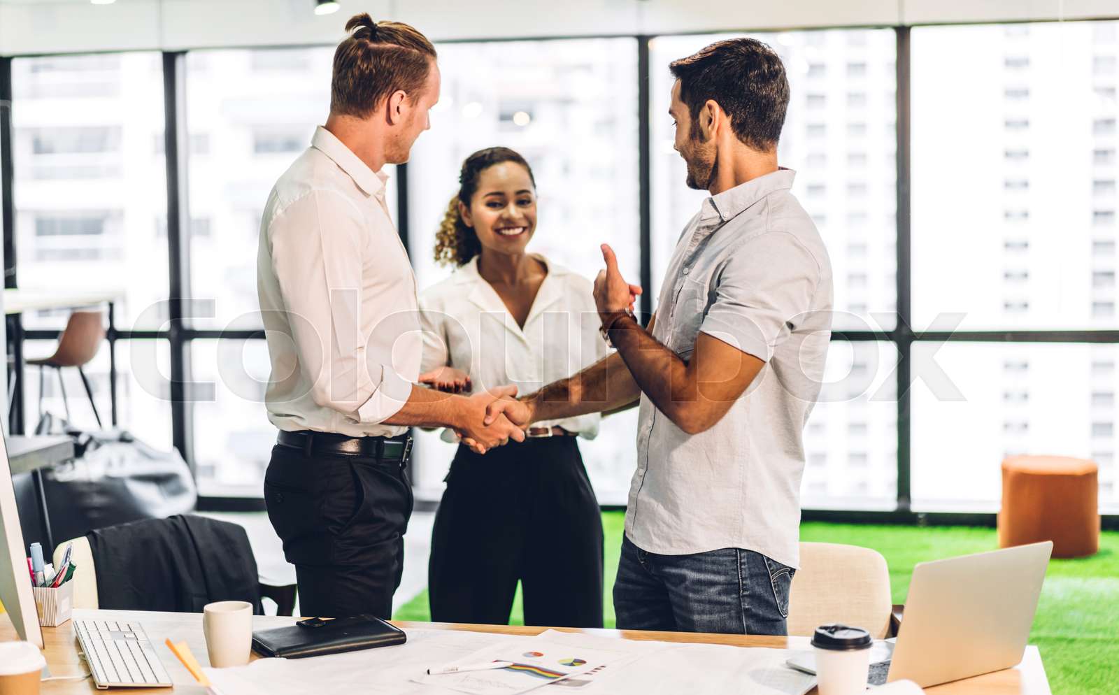 Two business partners in elegant suit successful handshake together in ...