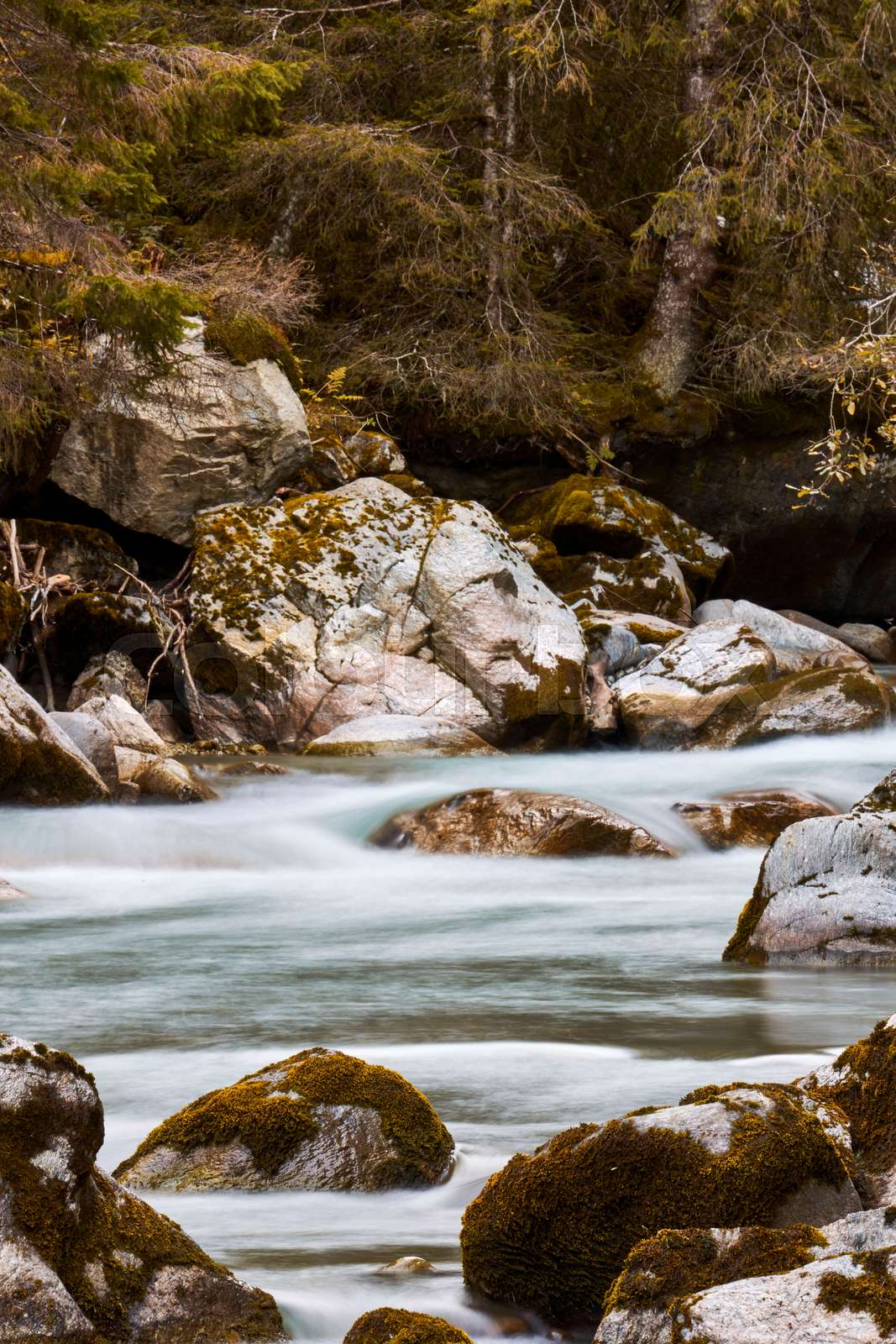 water stream coming down through rocks | Stock image | Colourbox