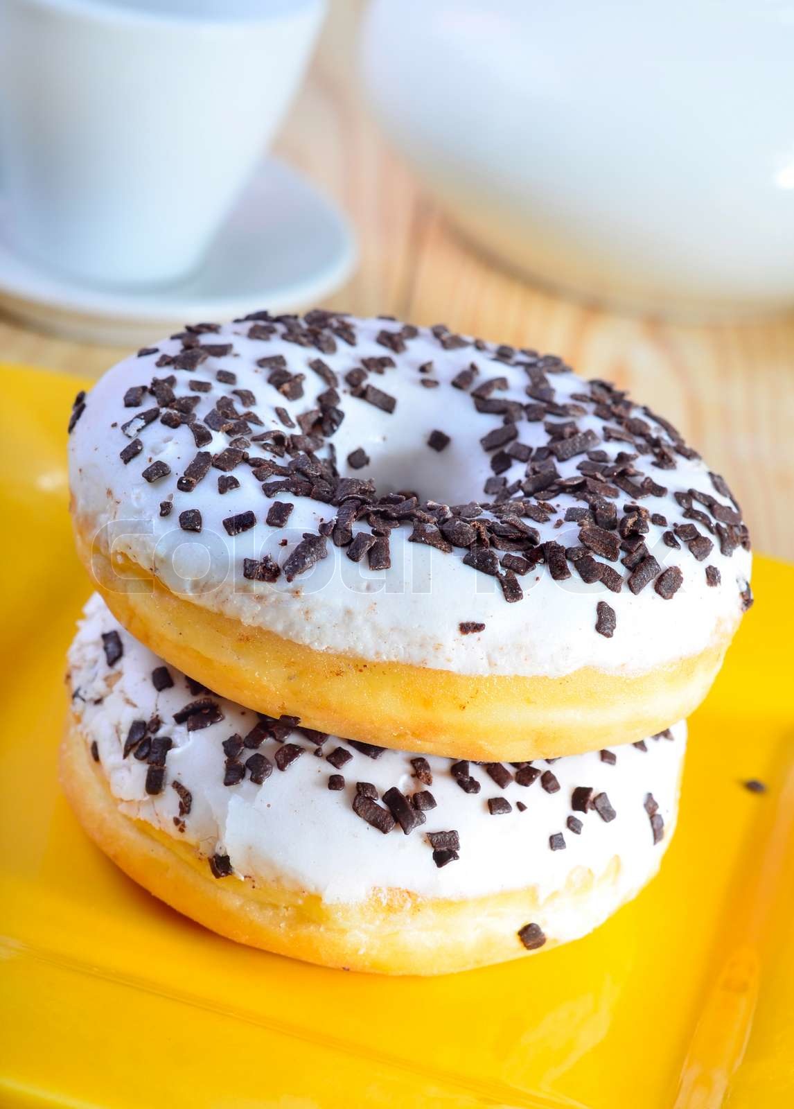Delicious doughnuts on the yellow plate, donuts with chocolate | Stock ...