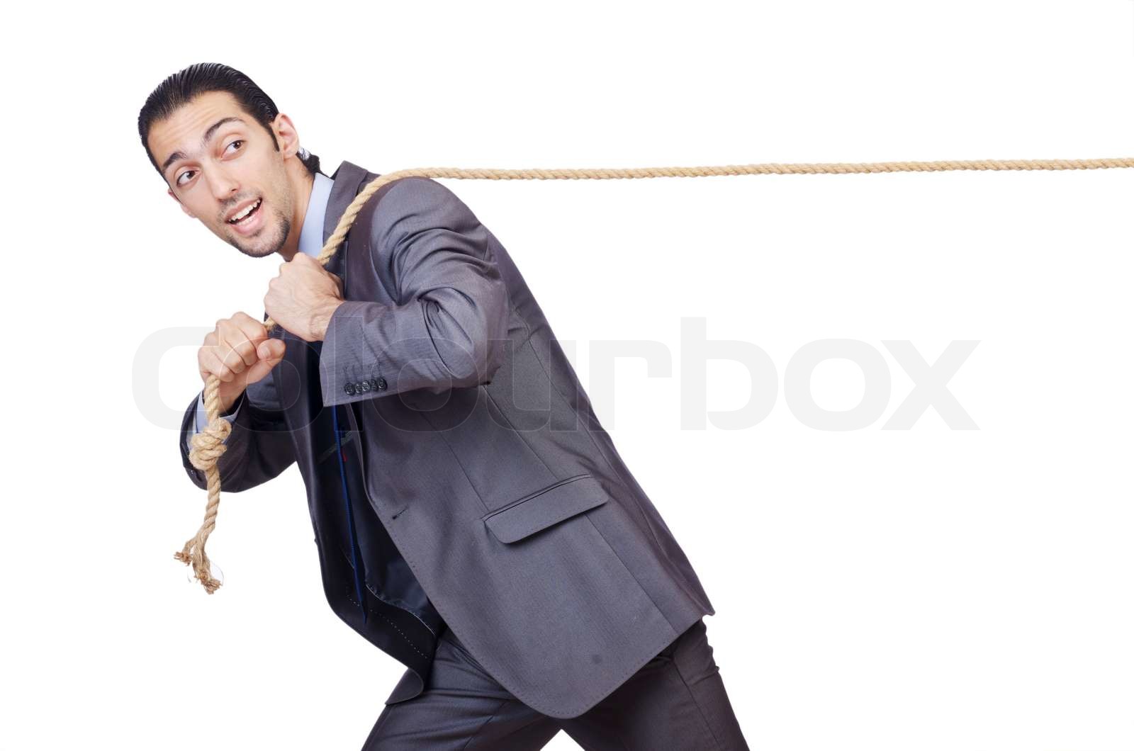 Businessman pulling rope on white | Stock image | Colourbox