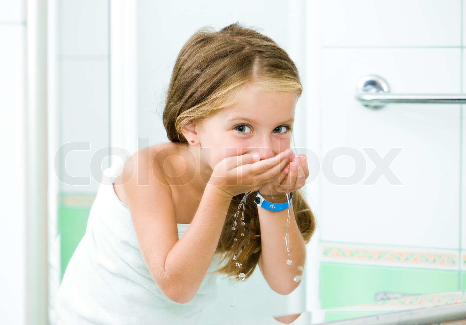 Cute little girl washing | Stock image | Colourbox