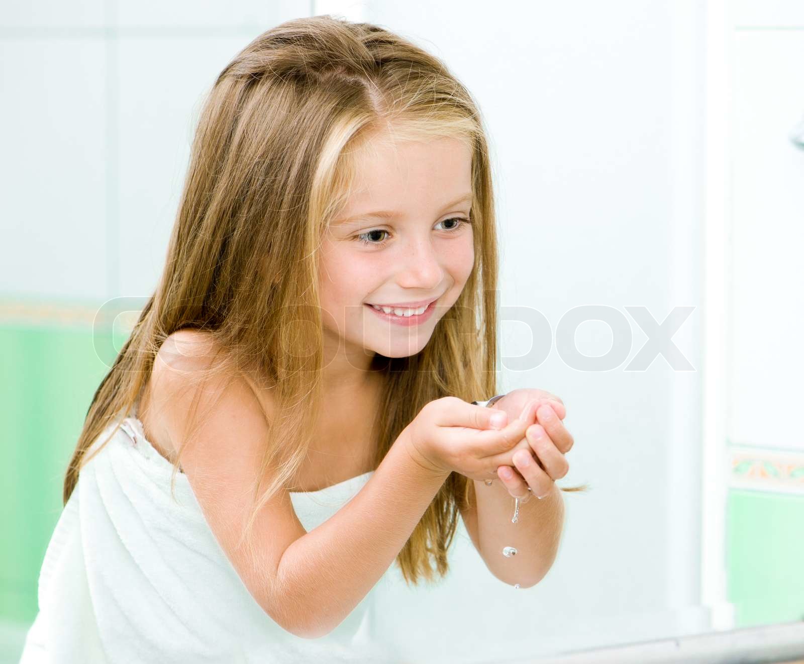 Cute little girl washing | Stock image | Colourbox